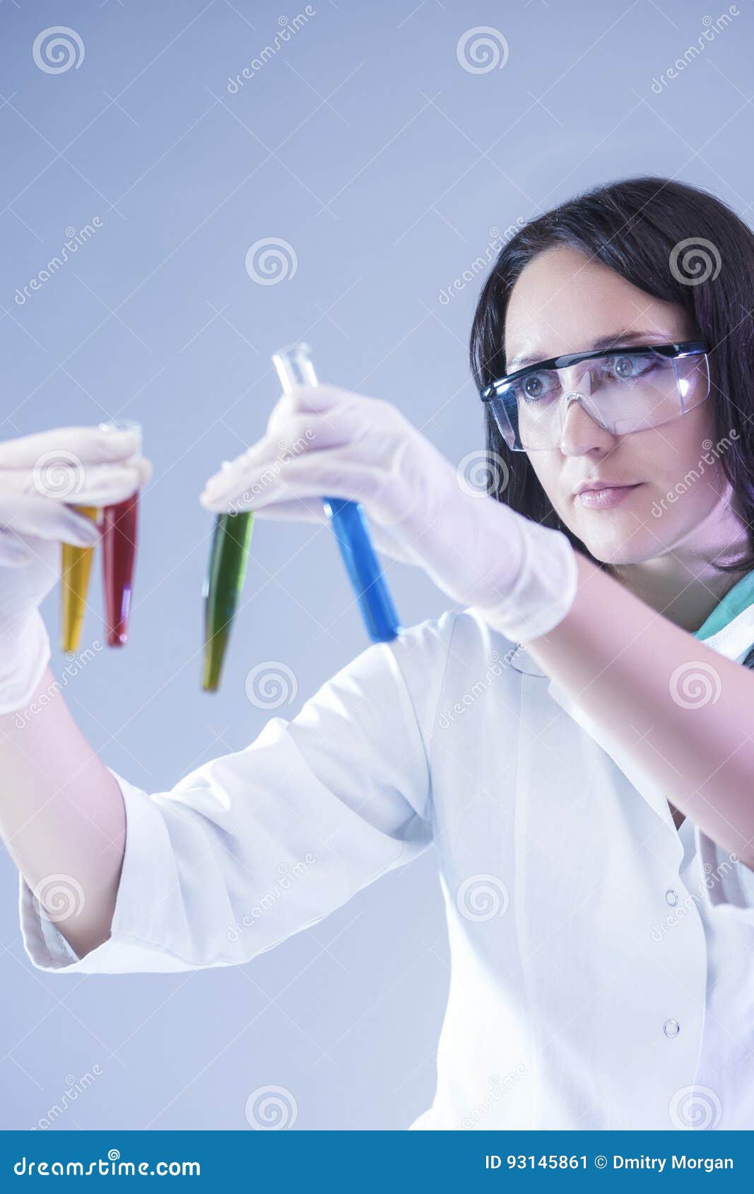 Female Laboratory Worker Dealing with Flasks Containing Liquid ...