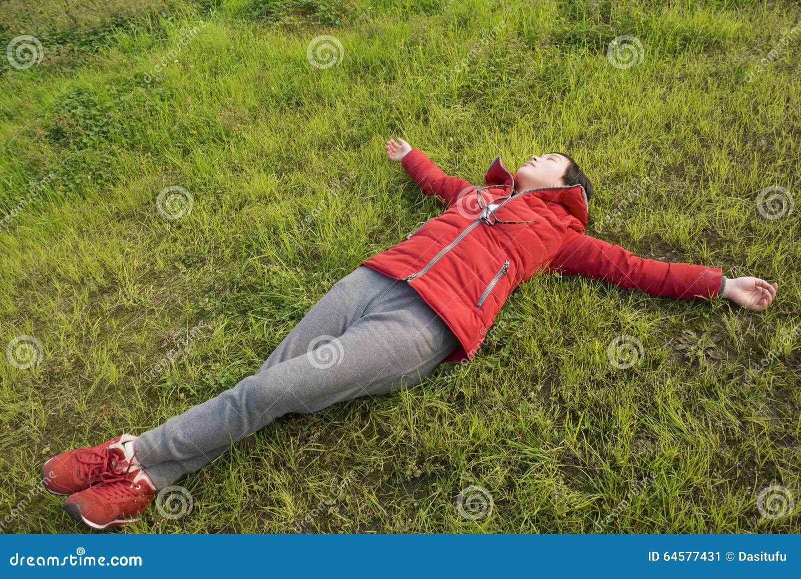 Female laying on lawn stock image. Image of rest, green - 64577431