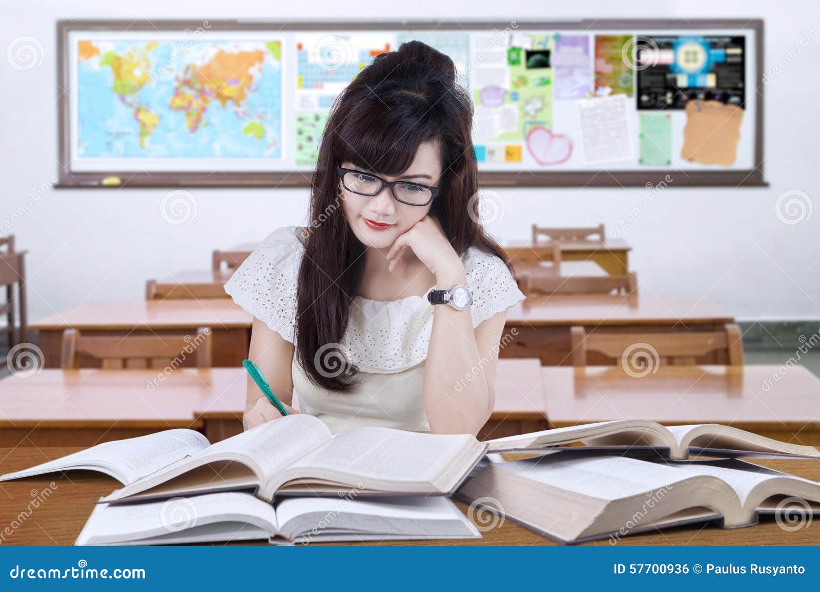 Female Learner Writing in the Classroom Stock Photo - Image of portrait ...