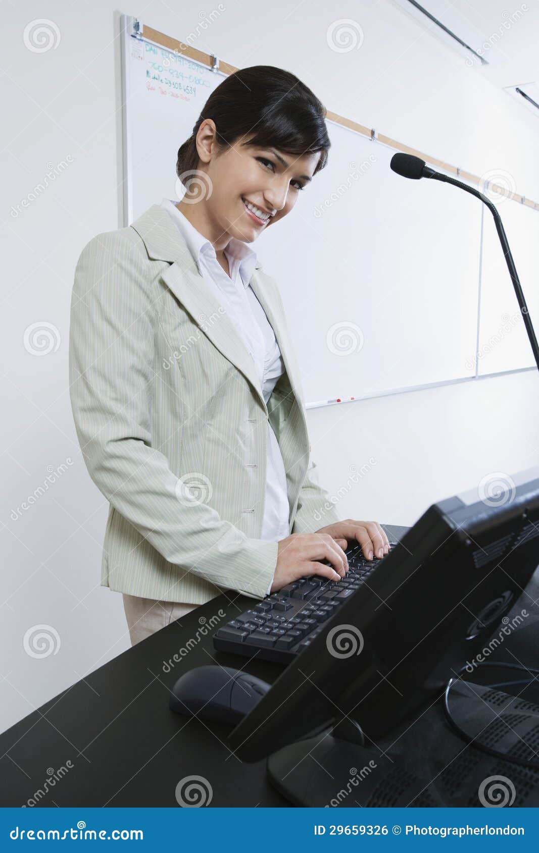 Female Lecturer Using Computer Stock Photo - Image of education ...
