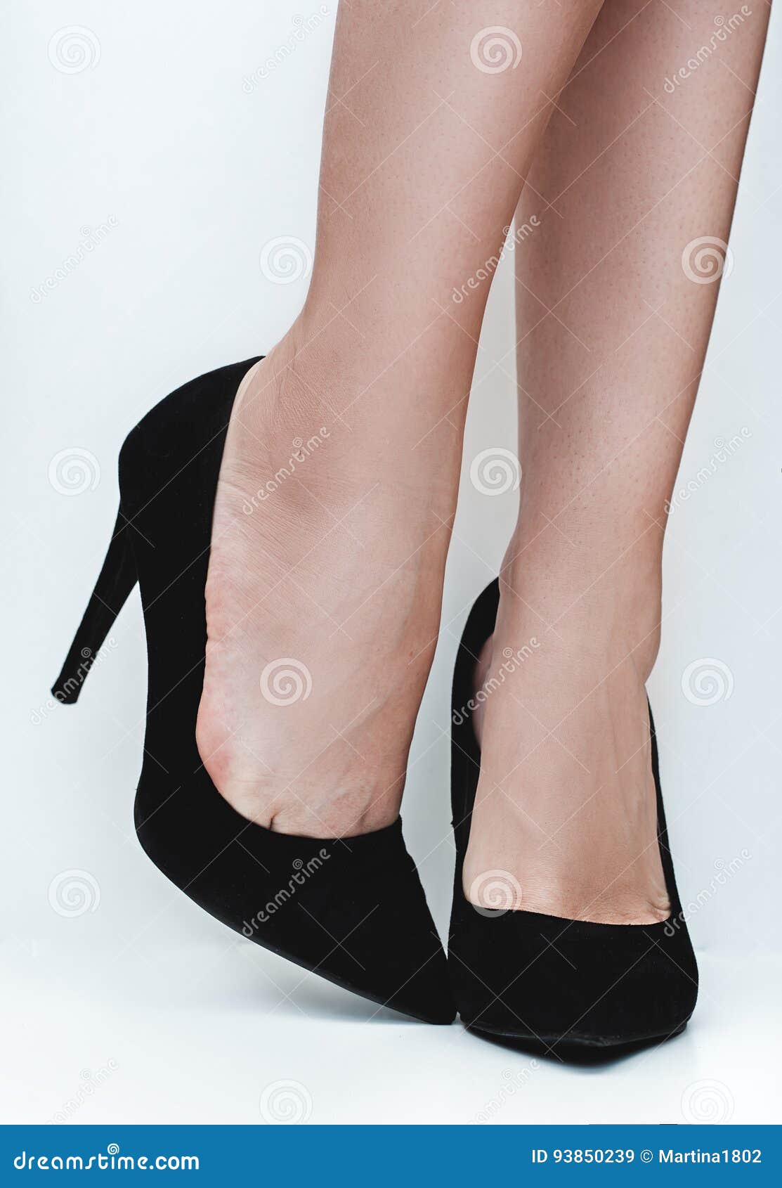 Female Legs With High Heels Isolated On A White Background Stock Image