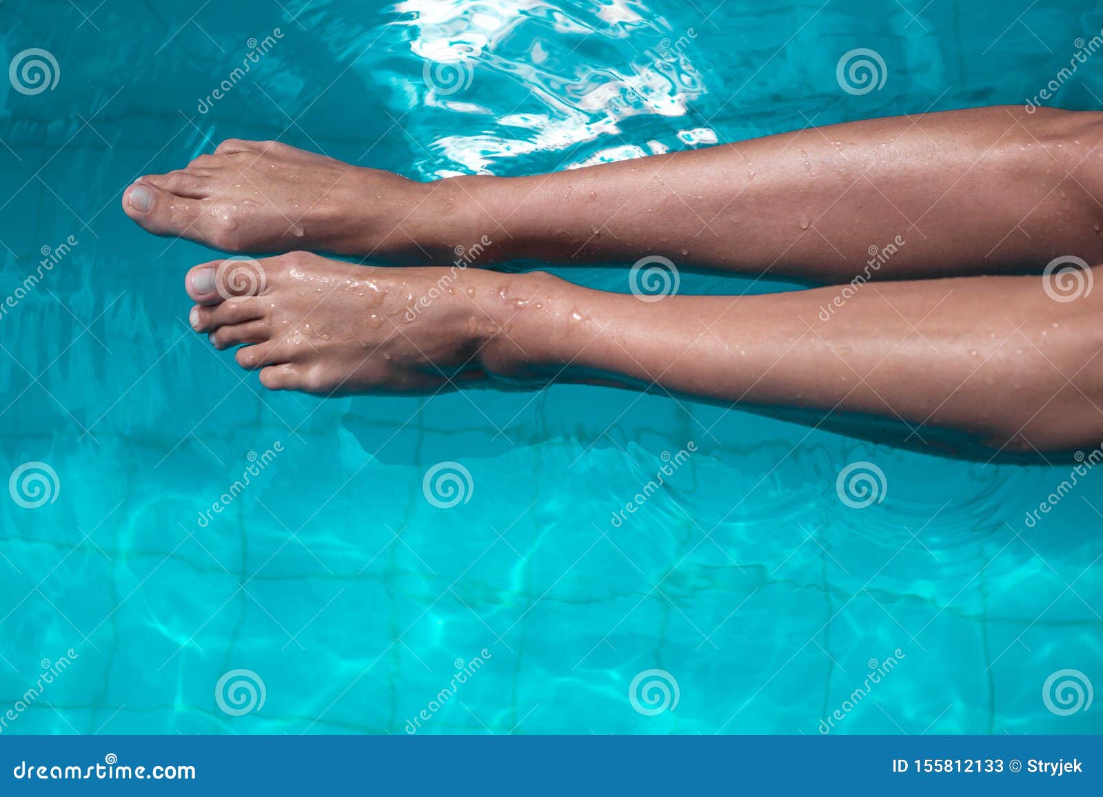 Female Legs in the Pool Water Stock Image - Image of legs, resting ...