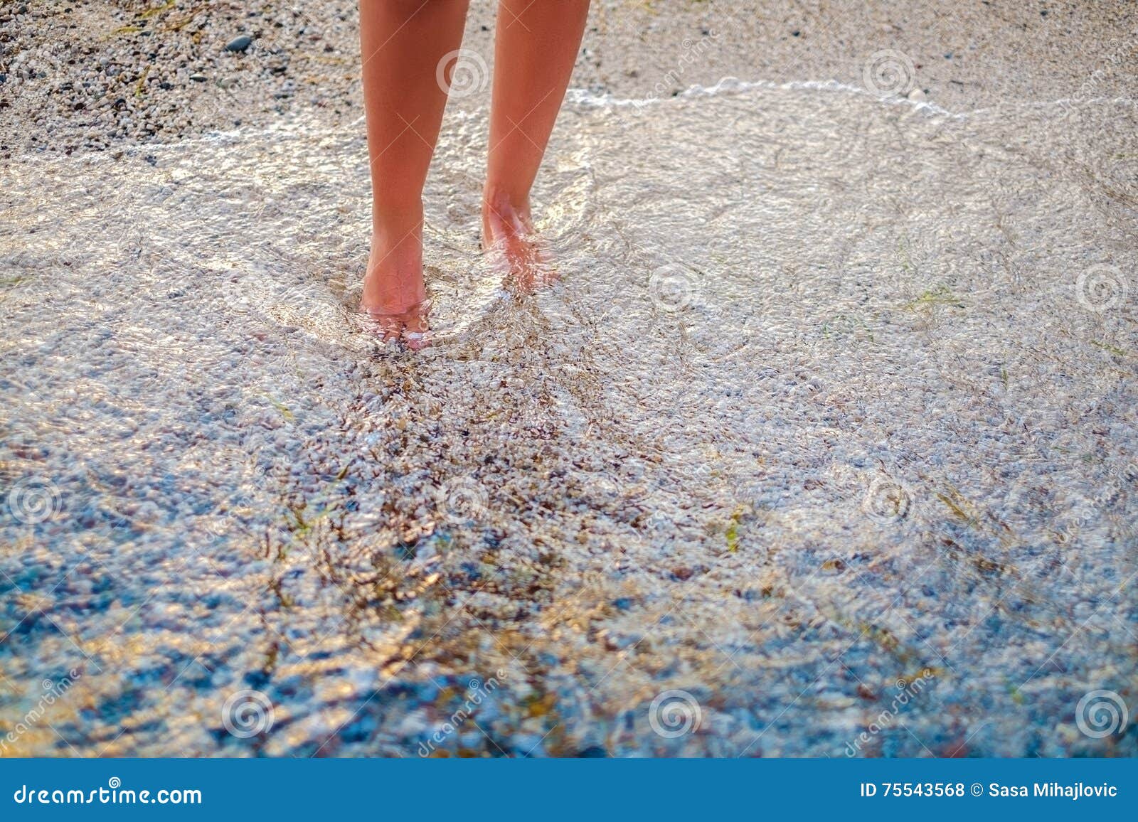 Female legs in sea stock photo. Image of island, beautiful - 75543568