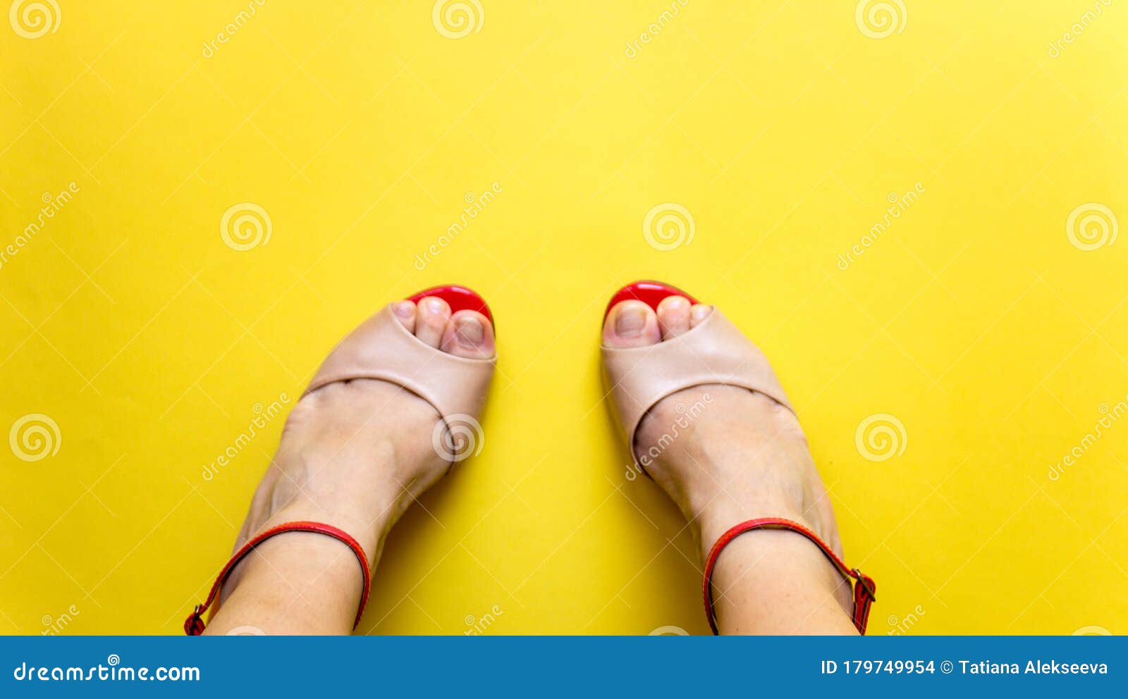 Female Legs And Summer Open Toes Shoes On Colorful Background Yellow Background Free Copy