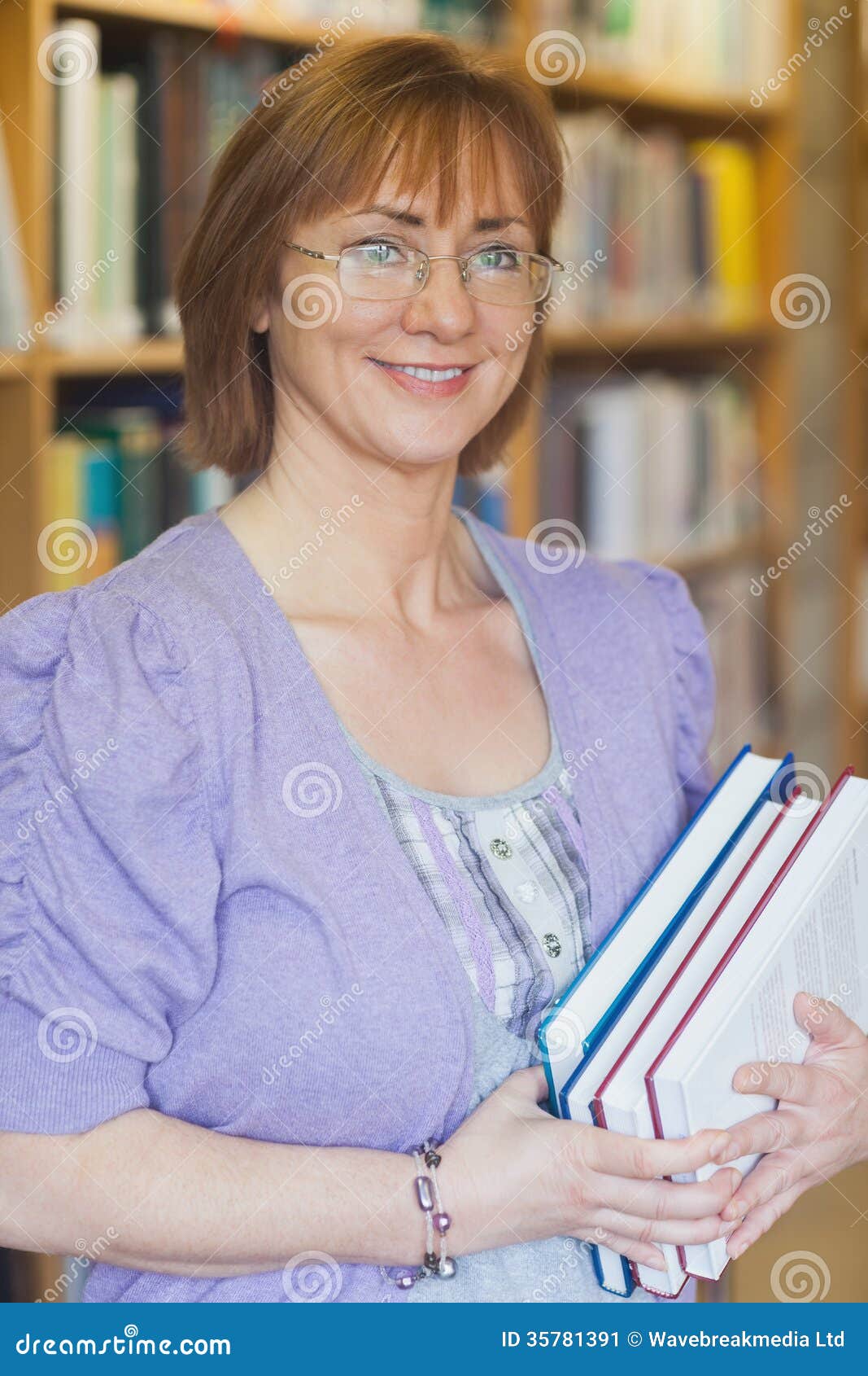 Female Librarian Posing Holding Some Books Stock Image - Image of ...