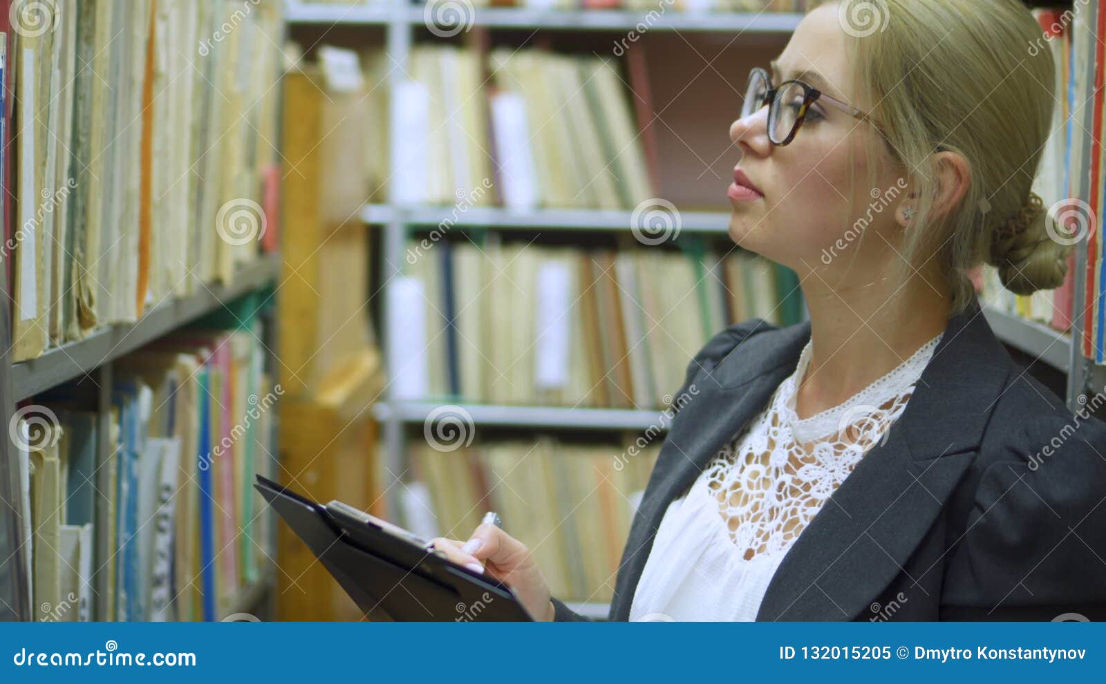 Female Librarian Writing on Clipboard at the Library Stock Video ...