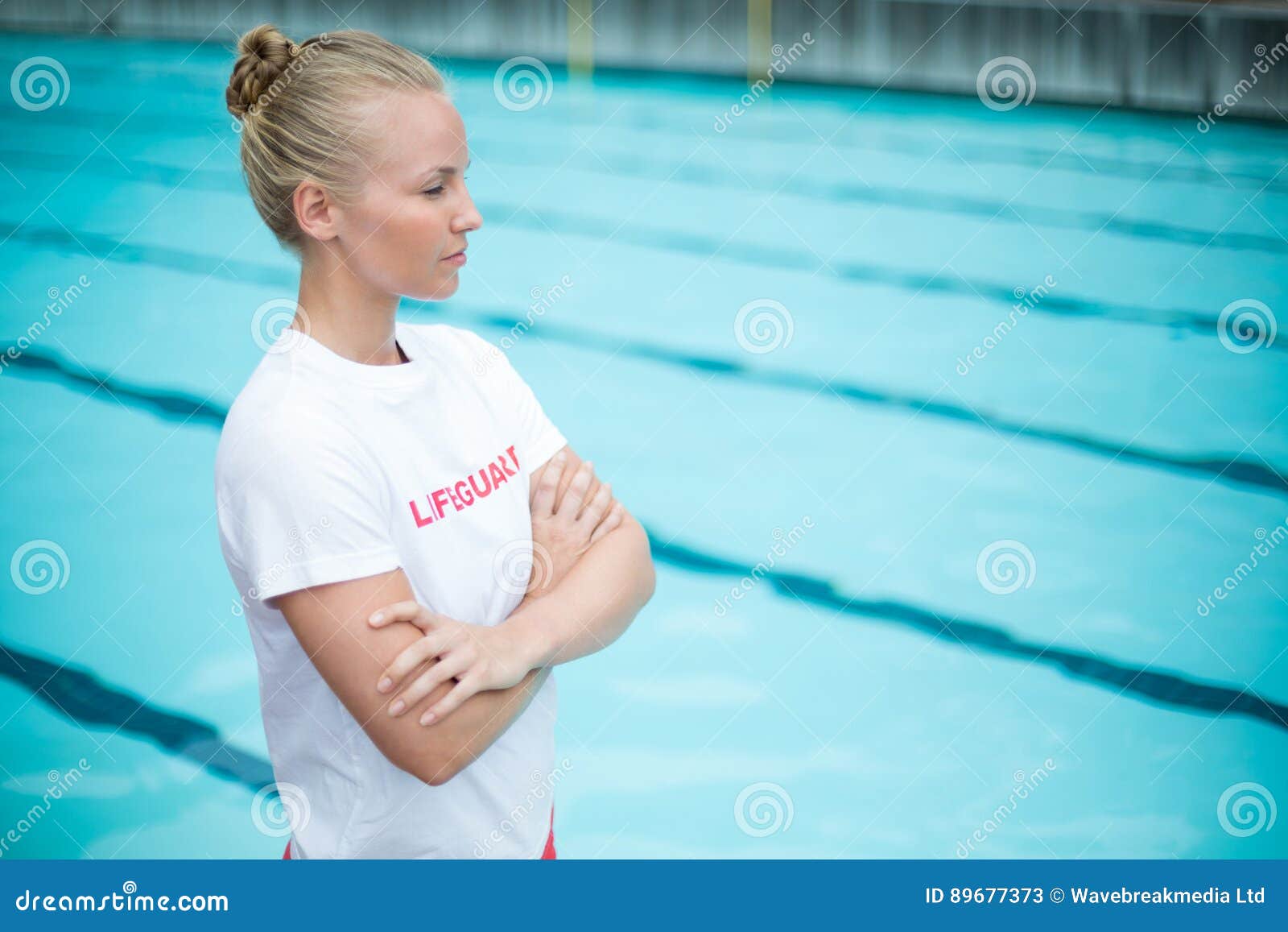 Female Lifeguard Standing at Poolside Stock Image - Image of pool ...