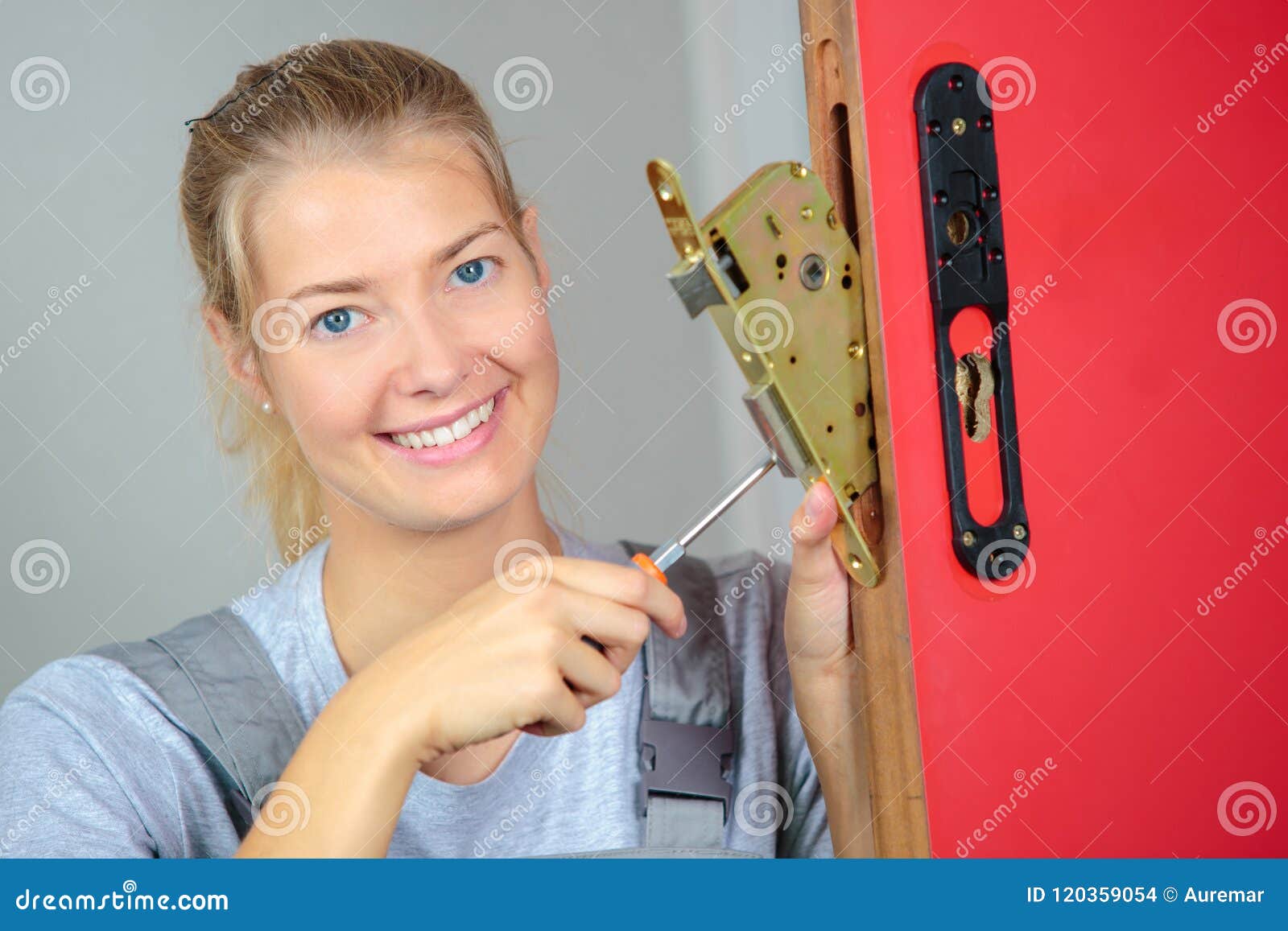 Female Lock Smith Posing and Smiling Stock Photo - Image of lock, house ...