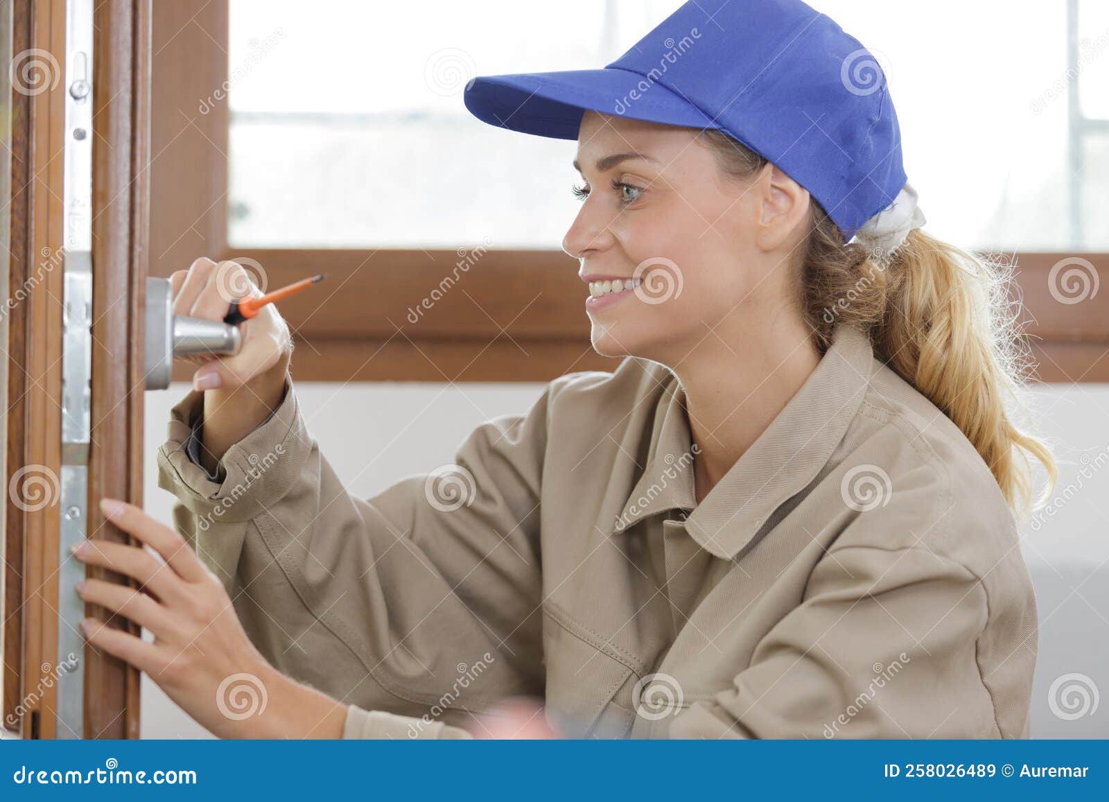 Female Lock Smith Posing and Smiling Stock Image - Image of door, build ...