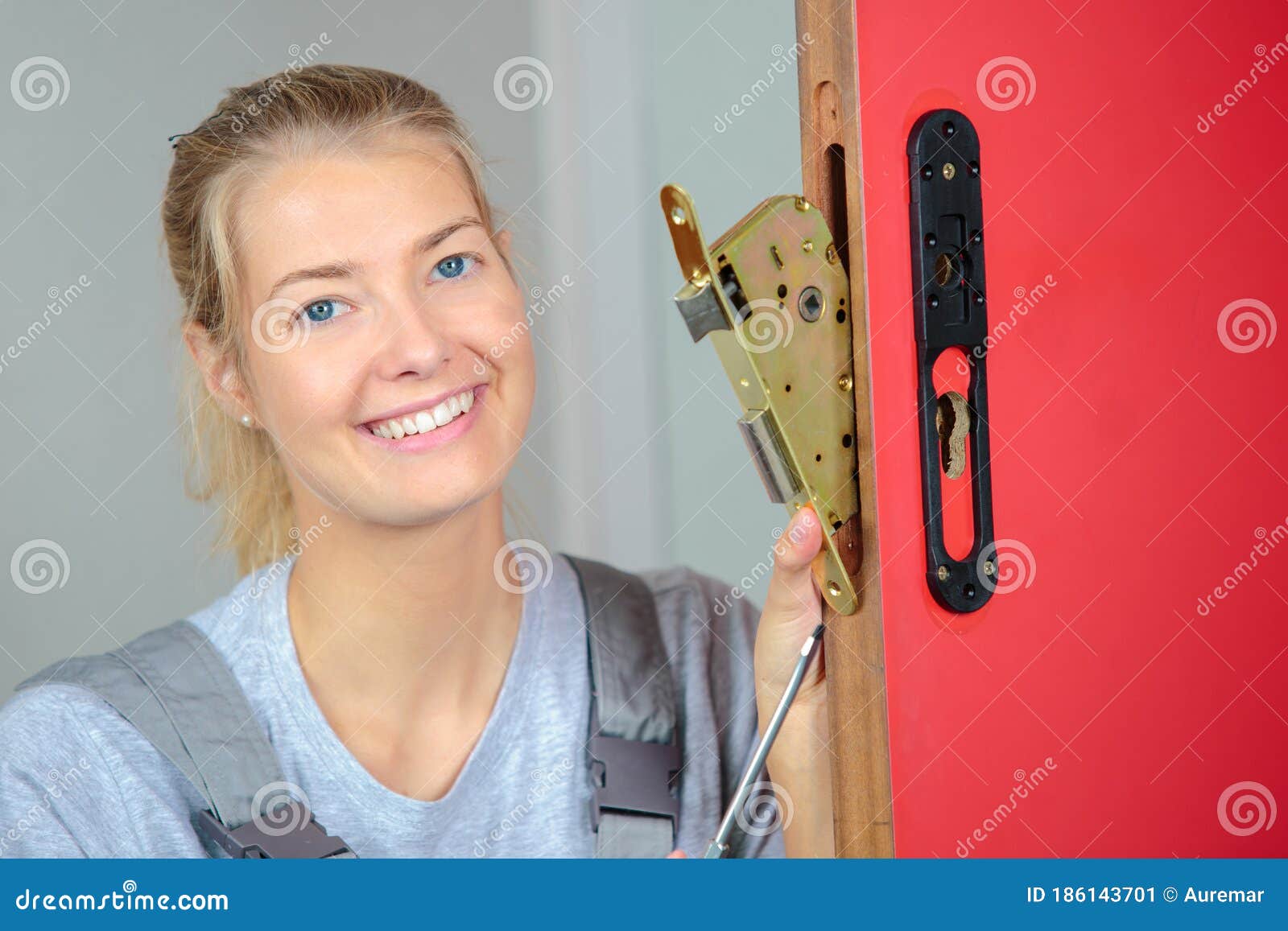 Female locksmith at work stock image. Image of structure - 186143701