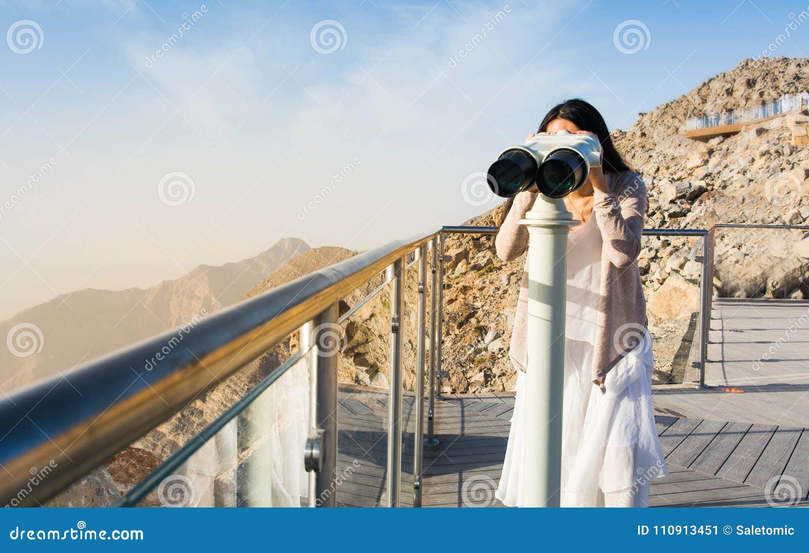 Female Using Public Binoculars at the Mountain Top Stock Image - Image ...