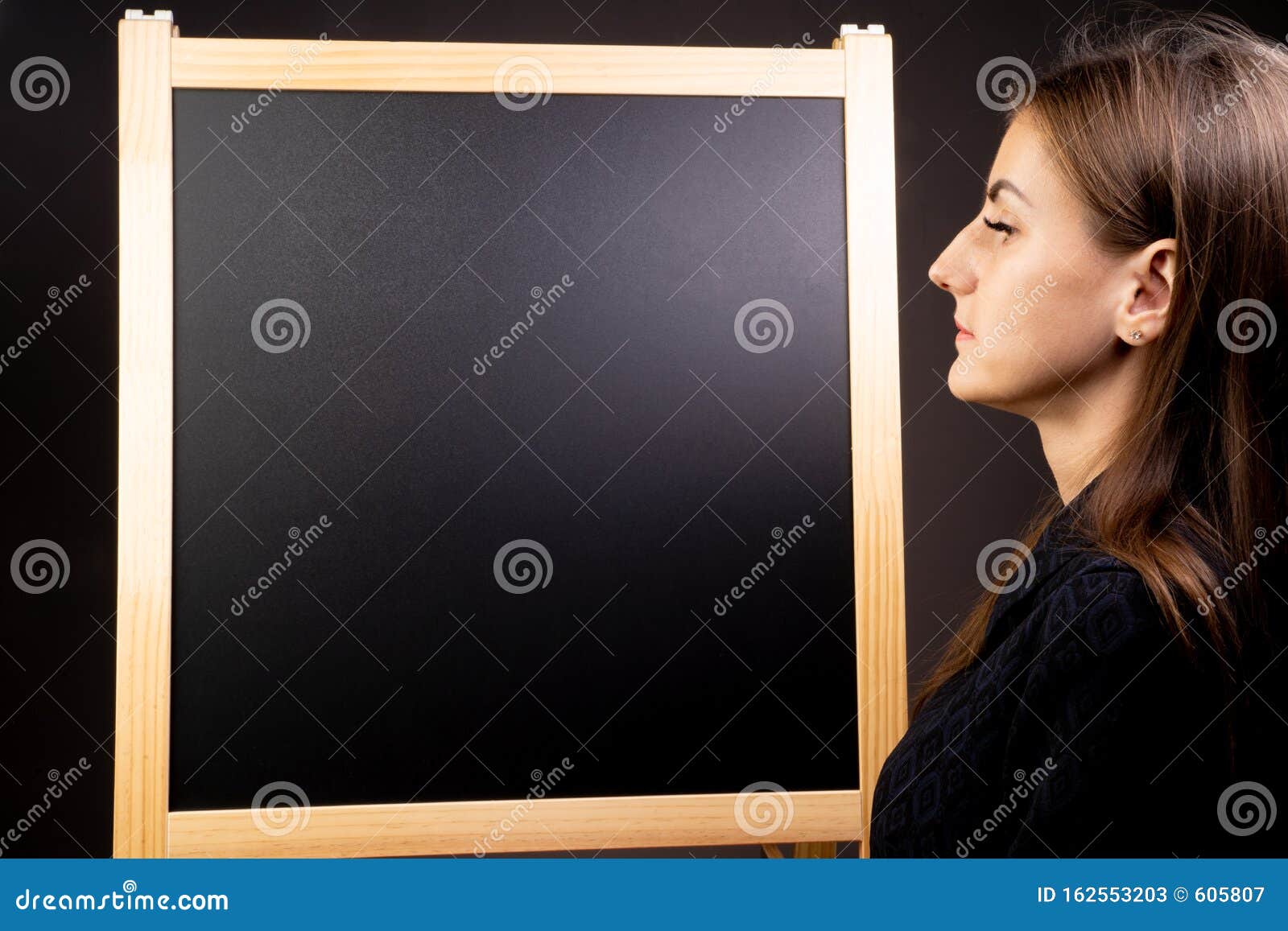 Female Looks at an Empty Blackboard on Which You Can Draw with Chalk ...
