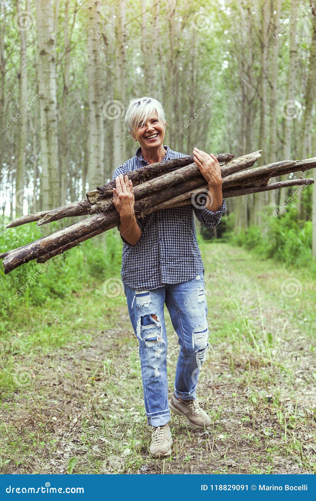 Female Lumberjack Carrying a Stack of Trunks Stock Image - Image of ...