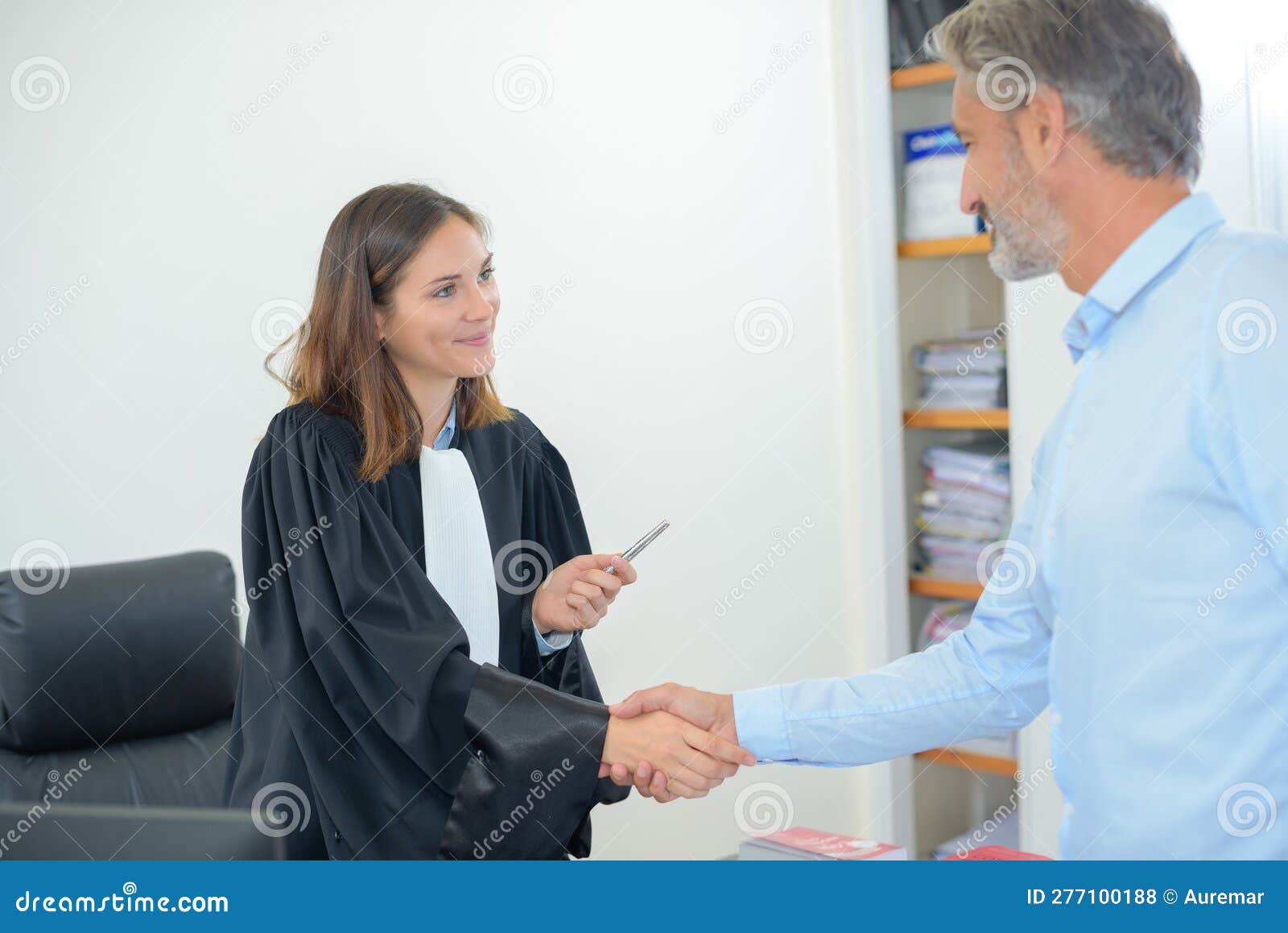 Female Magistrate Shaking Hands with Man Stock Photo - Image of male ...