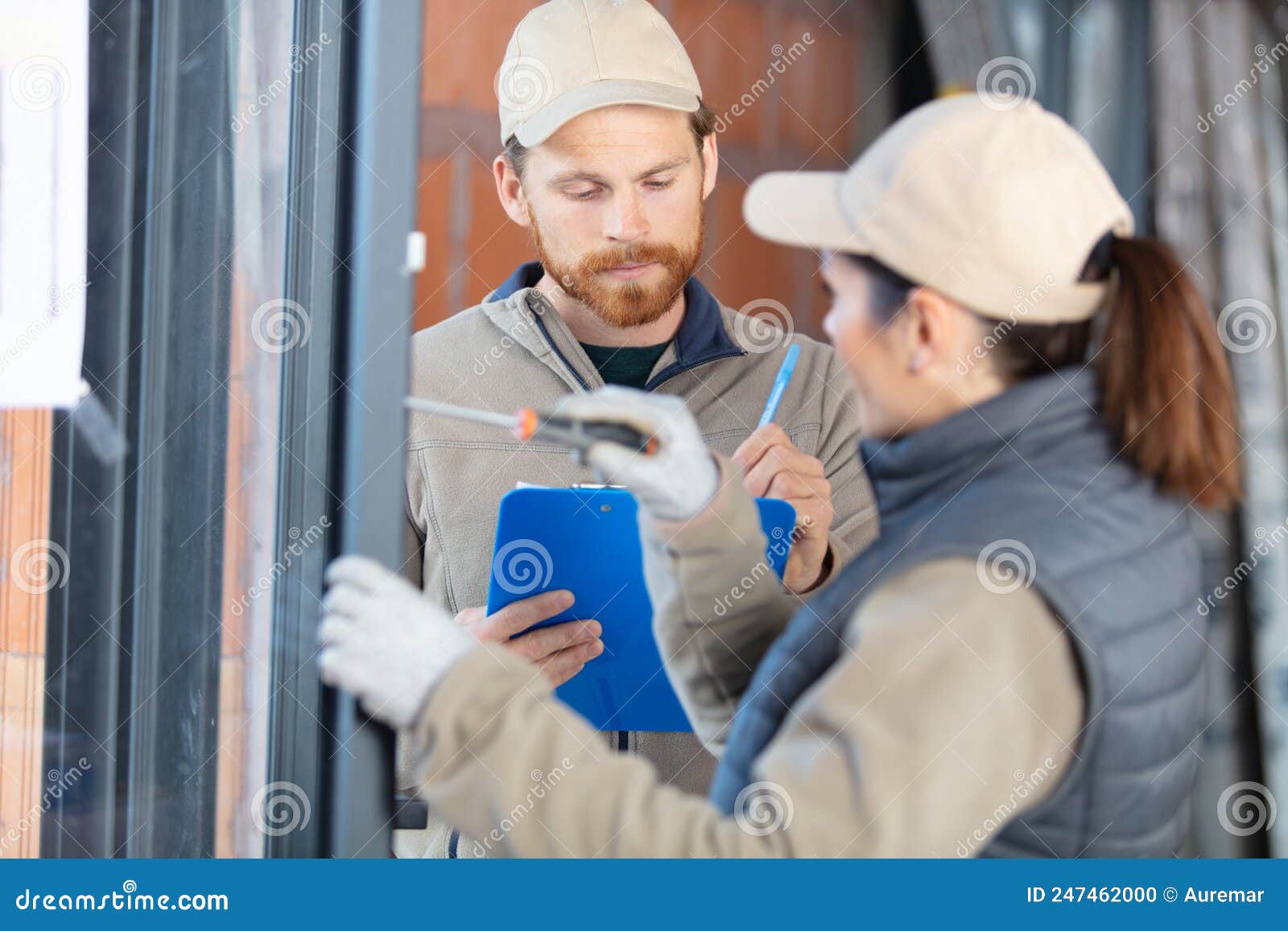 Female and Male Builders at Work Stock Photo - Image of smiling ...
