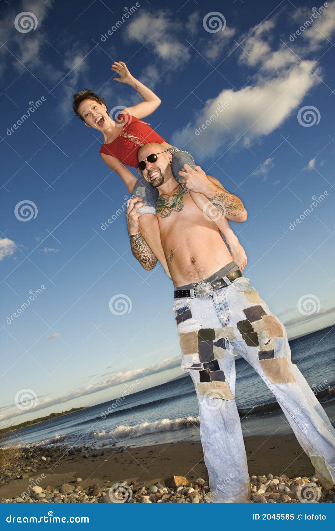 Female on man s shoulders. stock image. Image of shore - 2045585