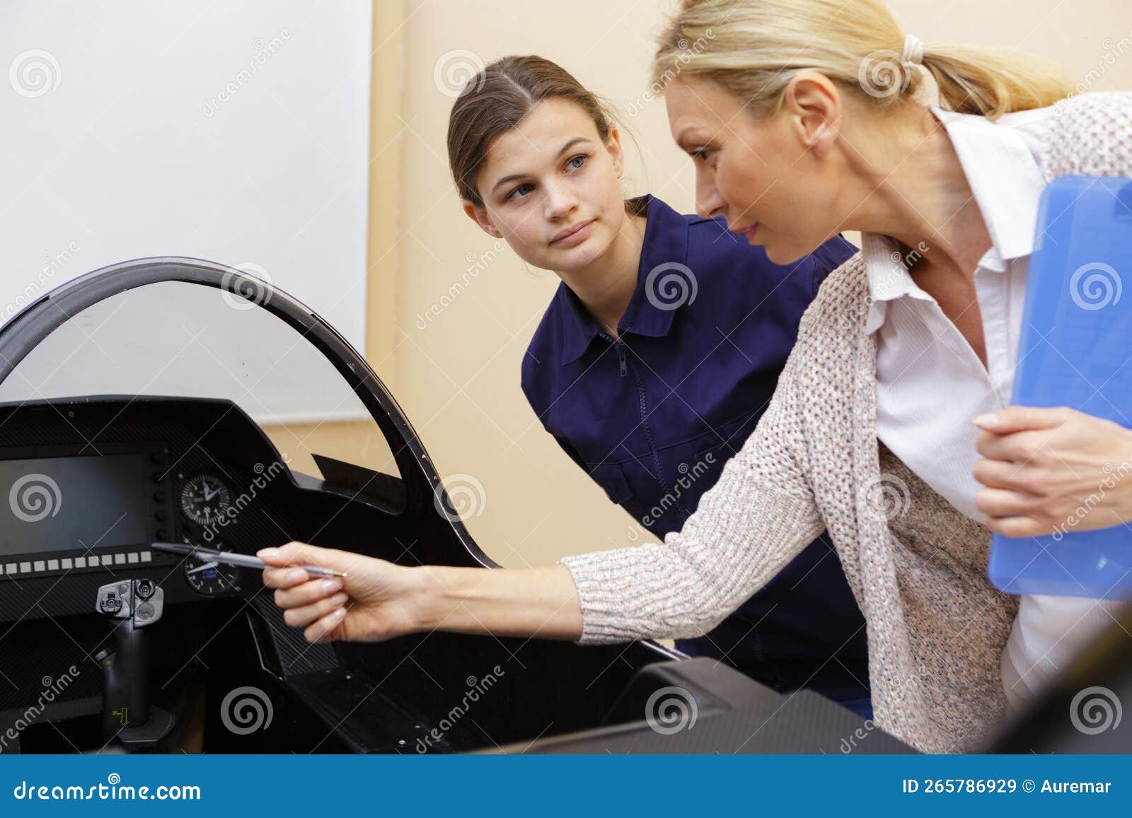 Female Manager and Apprentice Working on Engine Stock Image - Image of ...