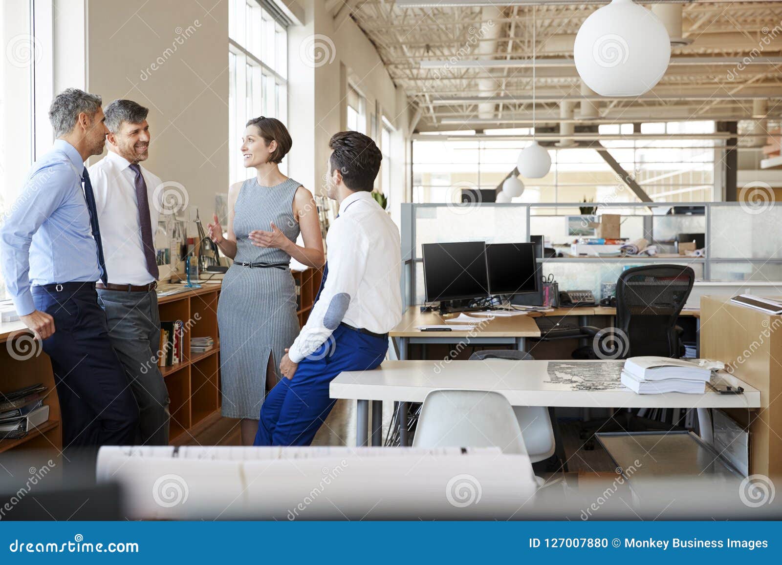 Female Manager in Discussion with Colleagues at Work Stock Photo ...