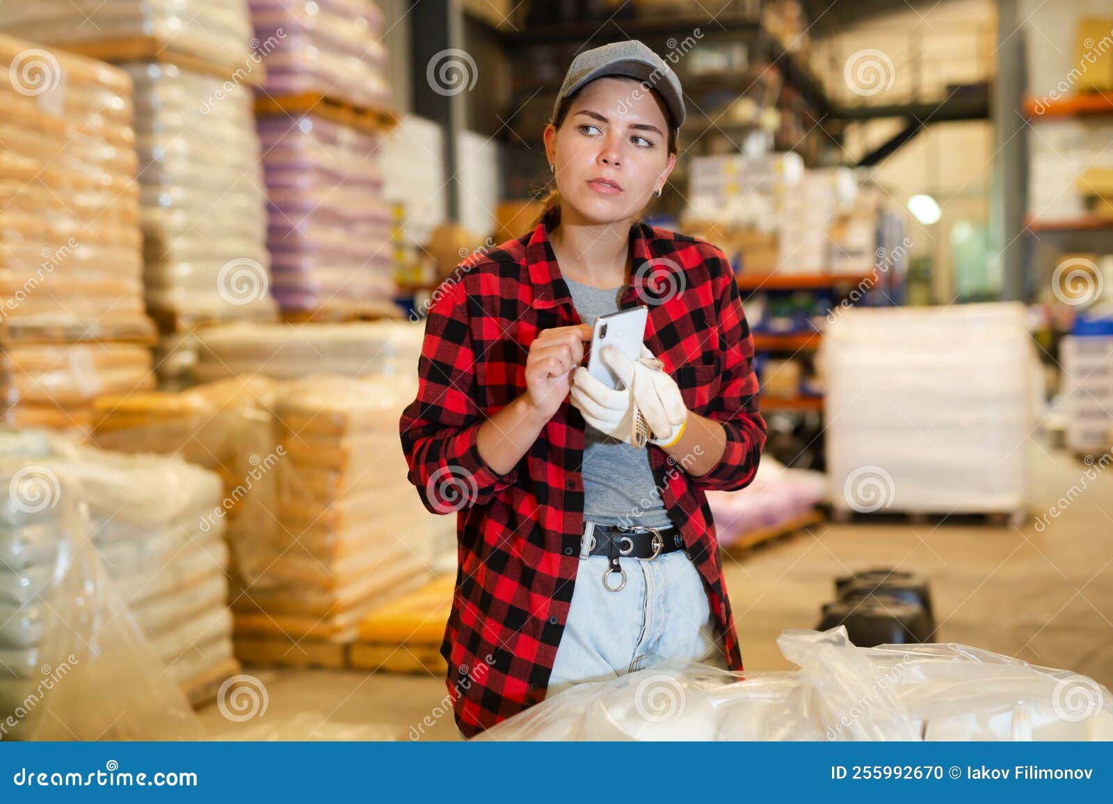 Female Manager Keeps Records of Bulk Construction Materials in the ...