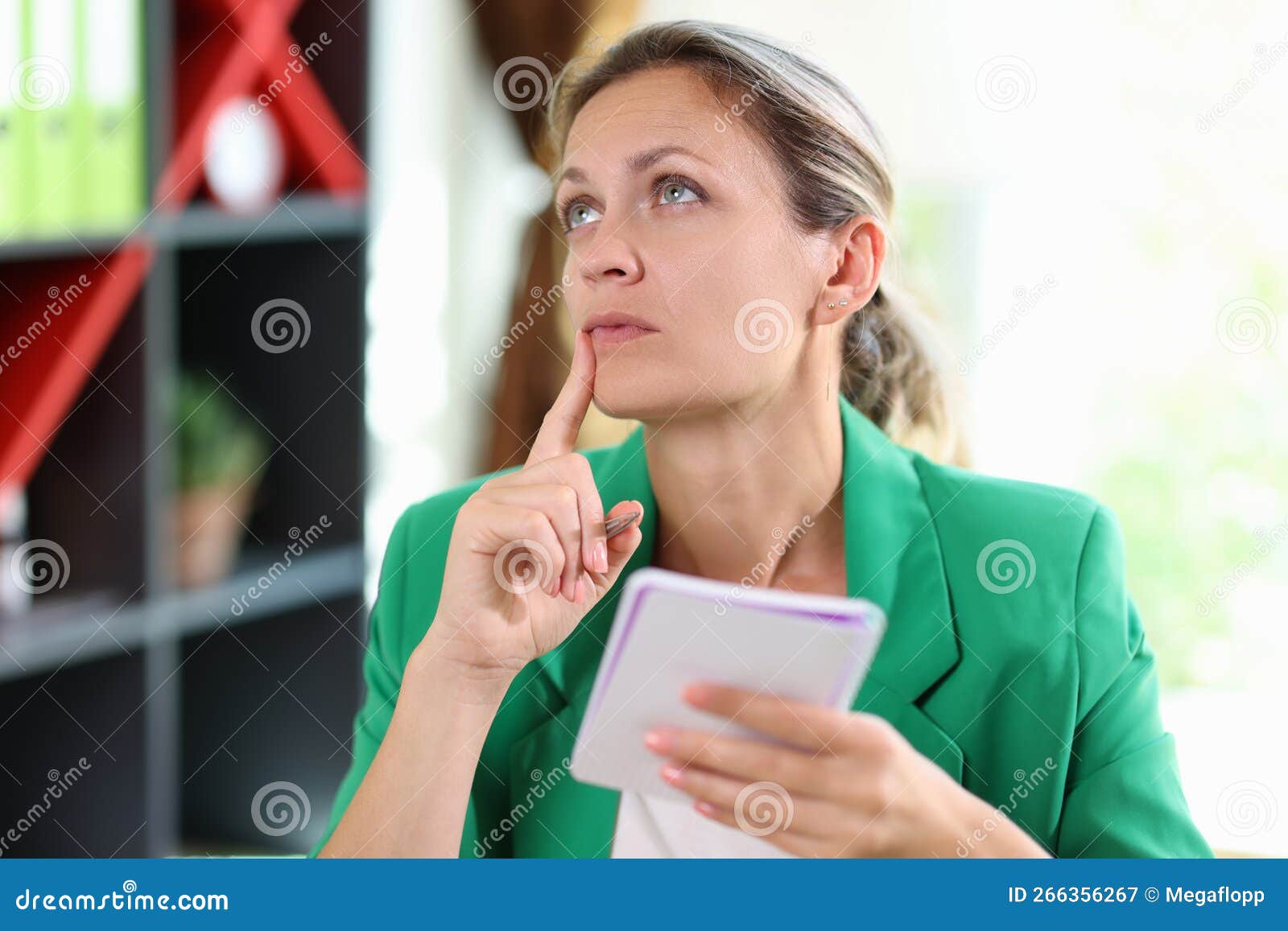 Female Manager Thinking with Notebook and Pen in Hands. Stock Image ...