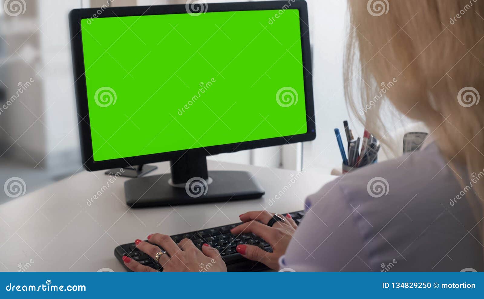 Female Manager Typing Documents on Personal Computer with Green Screen ...
