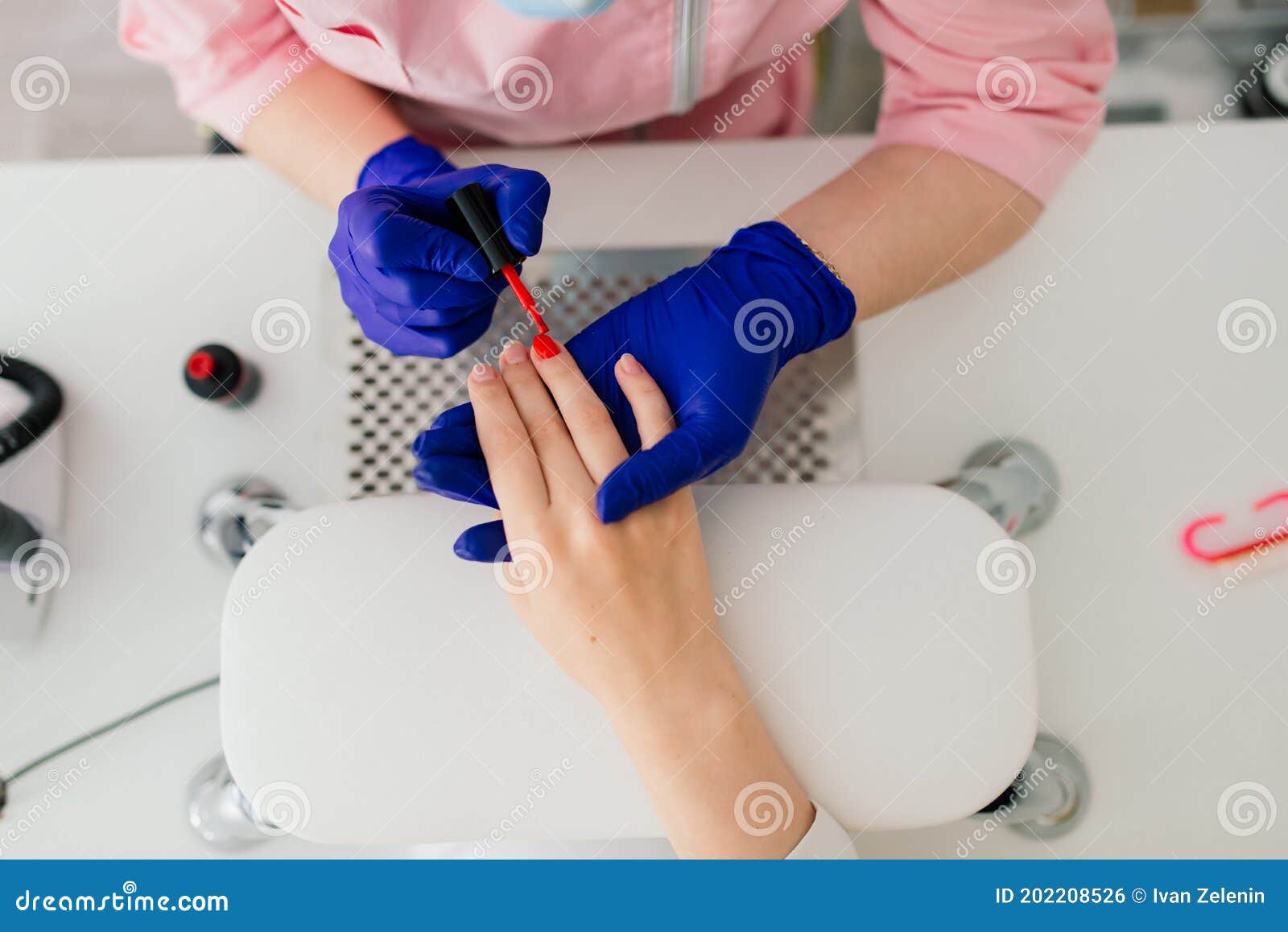 Female Manicure Master in a Beauty Salon Work with Hands of the Client ...
