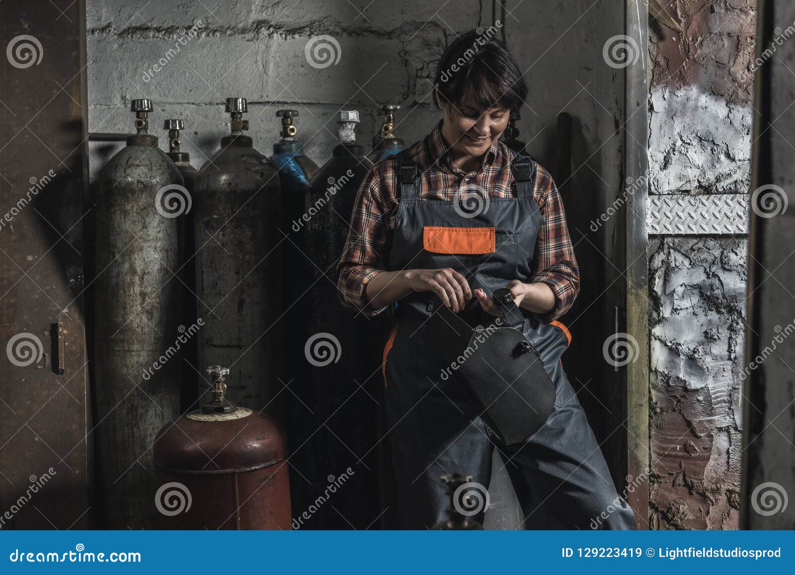 Female Manual Worker Getting Ready before Work Stock Image - Image of ...