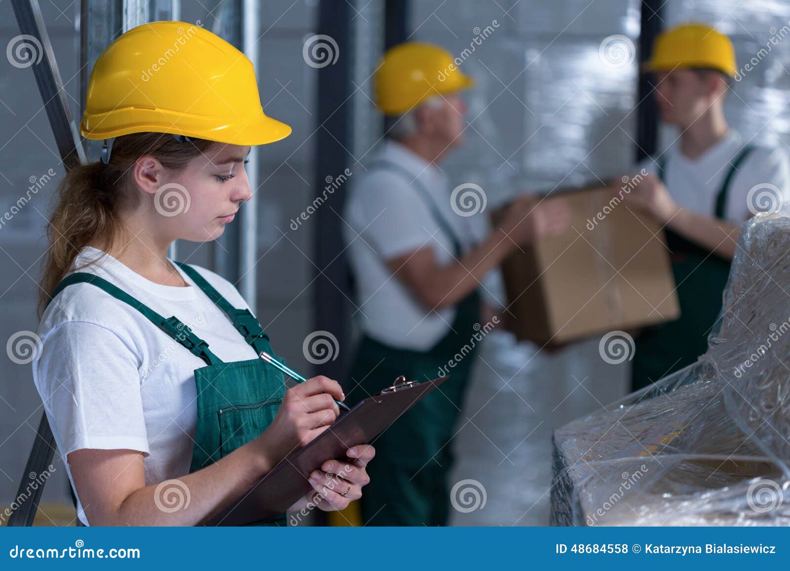 Female Manufacturing Labourer Holding Clipboard Stock Photo - Image of ...