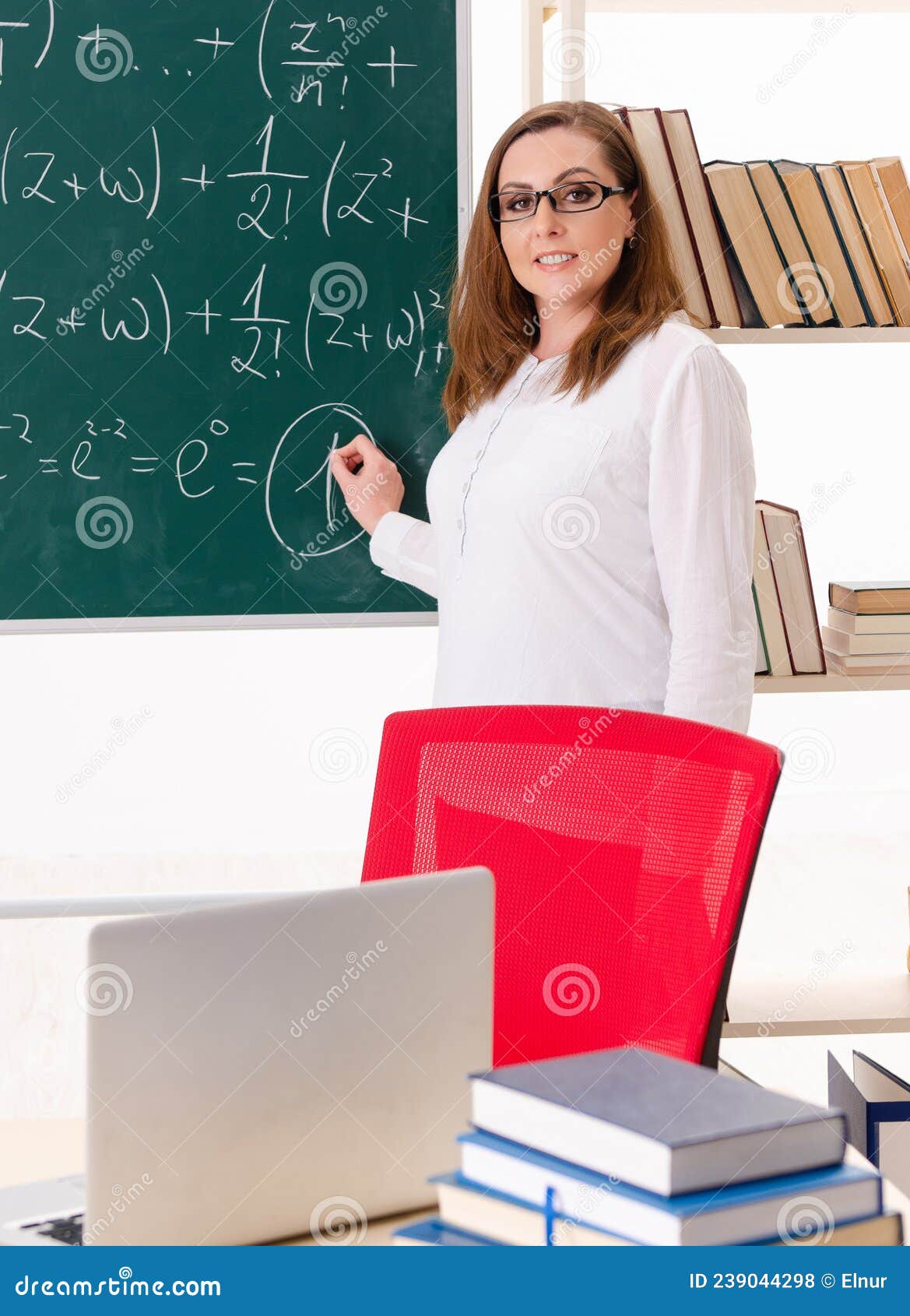 The Female Math Teacher in the Classroom Stock Photo - Image of book ...
