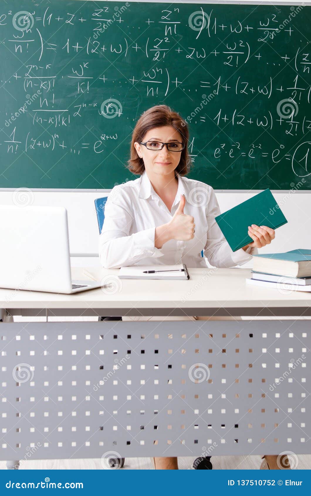 The Female Math Teacher in Front of the Chalkboard Stock Photo - Image ...