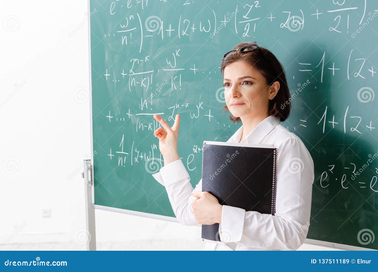 The Female Math Teacher in Front of the Chalkboard Stock Image - Image ...