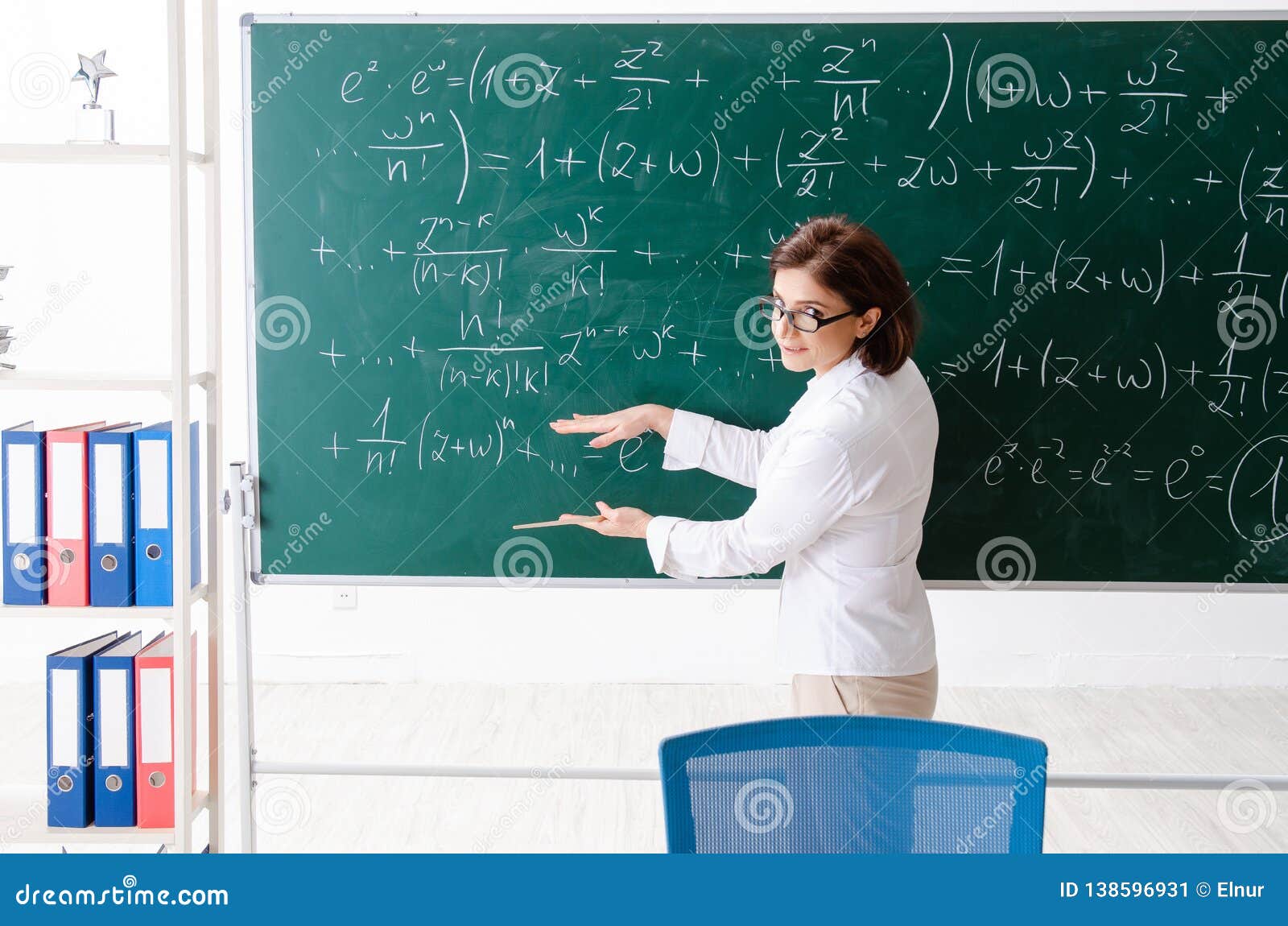 The Female Math Teacher in Front of the Chalkboard Stock Image - Image ...