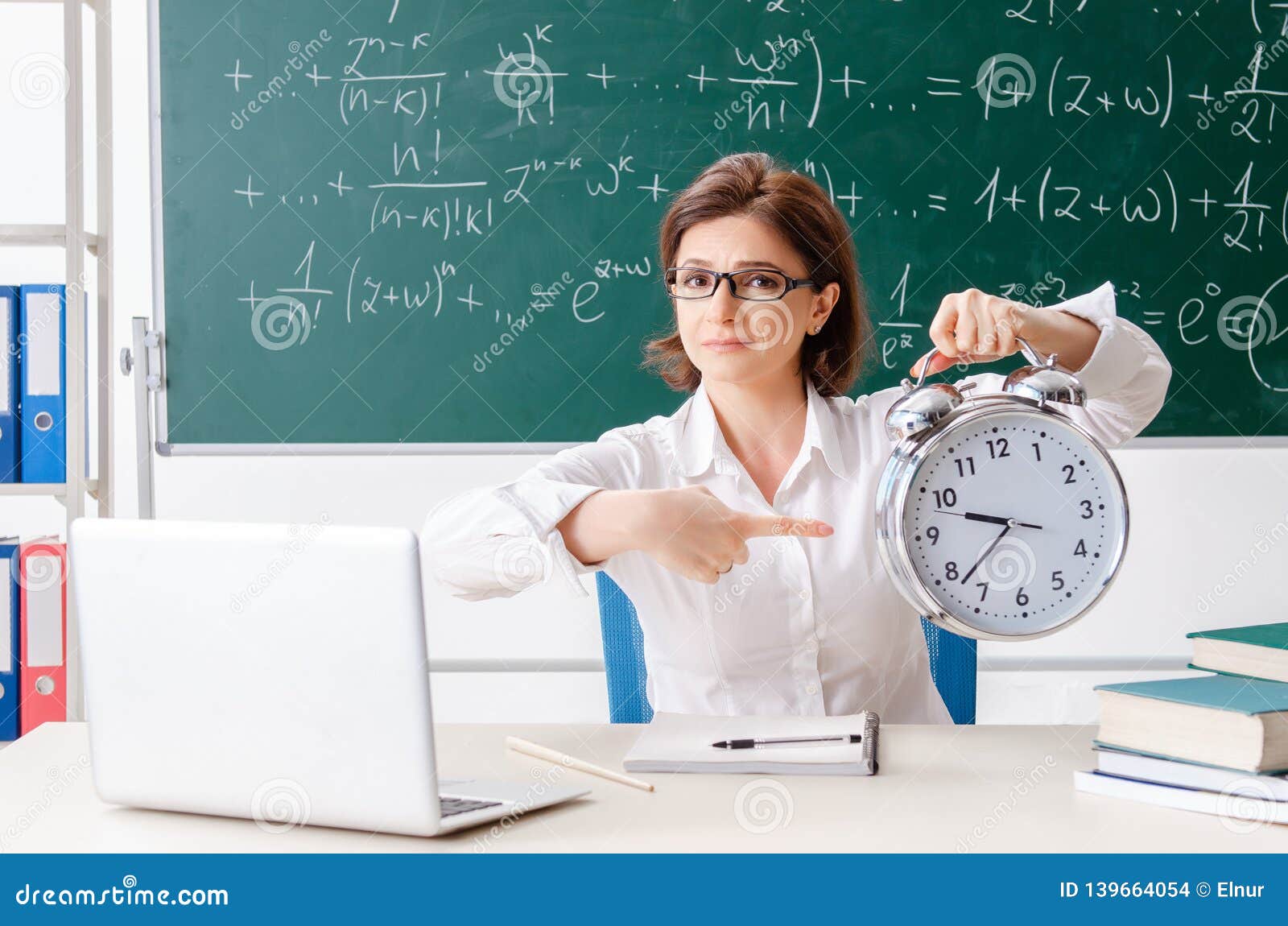 The Female Math Teacher in Front of the Chalkboard Stock Photo - Image ...