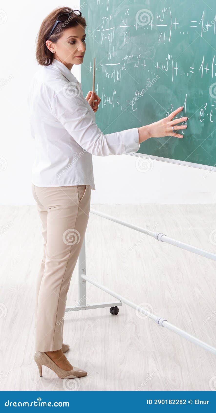 Female Math Teacher in Front of the Chalkboard Stock Photo - Image of ...