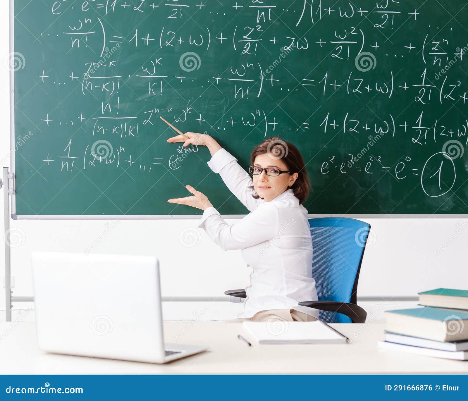 Female Math Teacher in Front of the Chalkboard Stock Photo - Image of ...