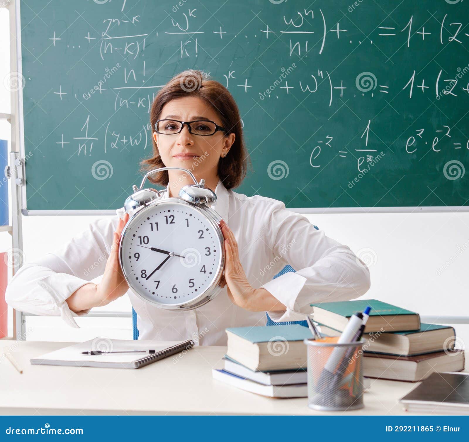 Female Math Teacher in Front of the Chalkboard Stock Image - Image of ...