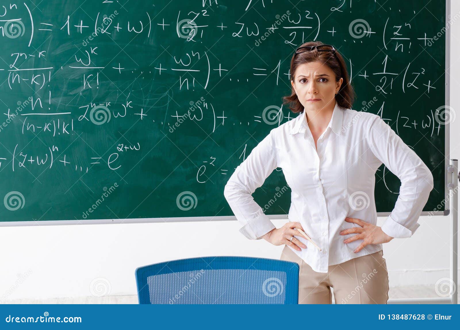 The Female Math Teacher in Front of the Chalkboard Stock Photo - Image ... The Female Math Teacher in Front of the Chalkboard Stock Photo - Image ...