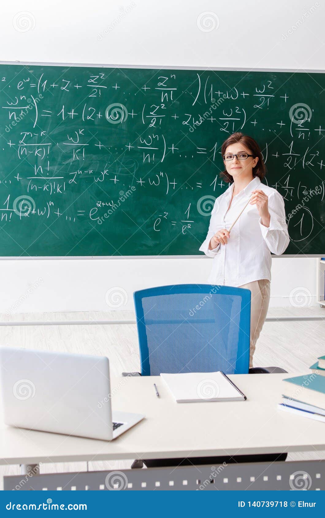 The Female Math Teacher in Front of the Chalkboard Stock Photo - Image ...