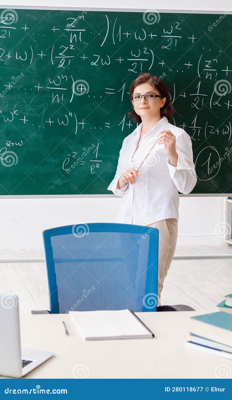 Female Math Teacher in Front of the Chalkboard Stock Image - Image of ...