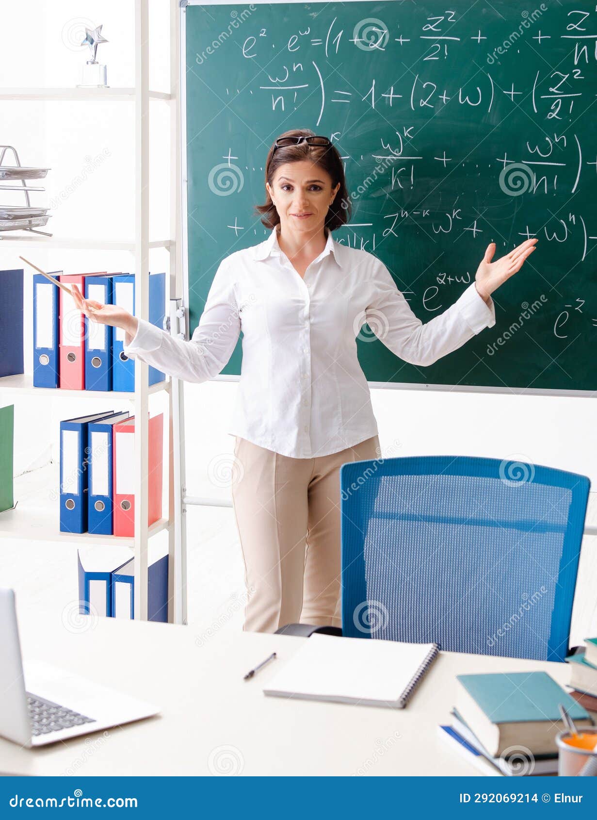 Female Math Teacher in Front of the Chalkboard Stock Photo - Image of ...
