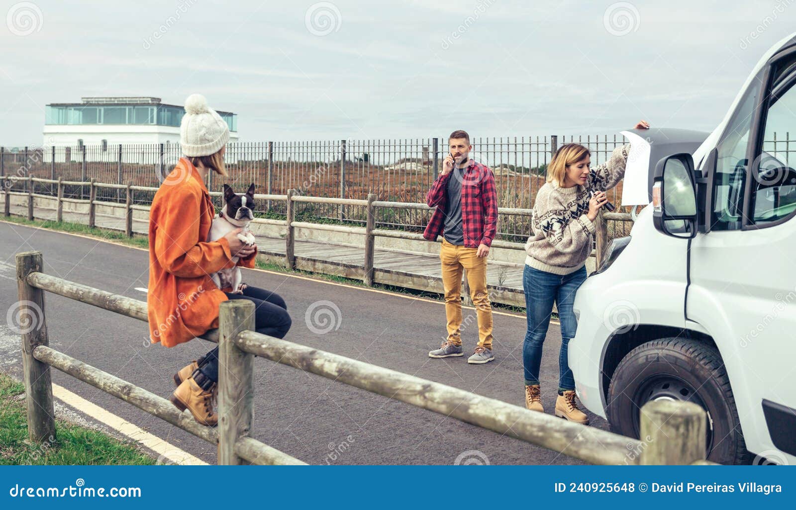 Female Mechanic Fixing the Camper Van of a Couple on a Trip Stock Photo ...
