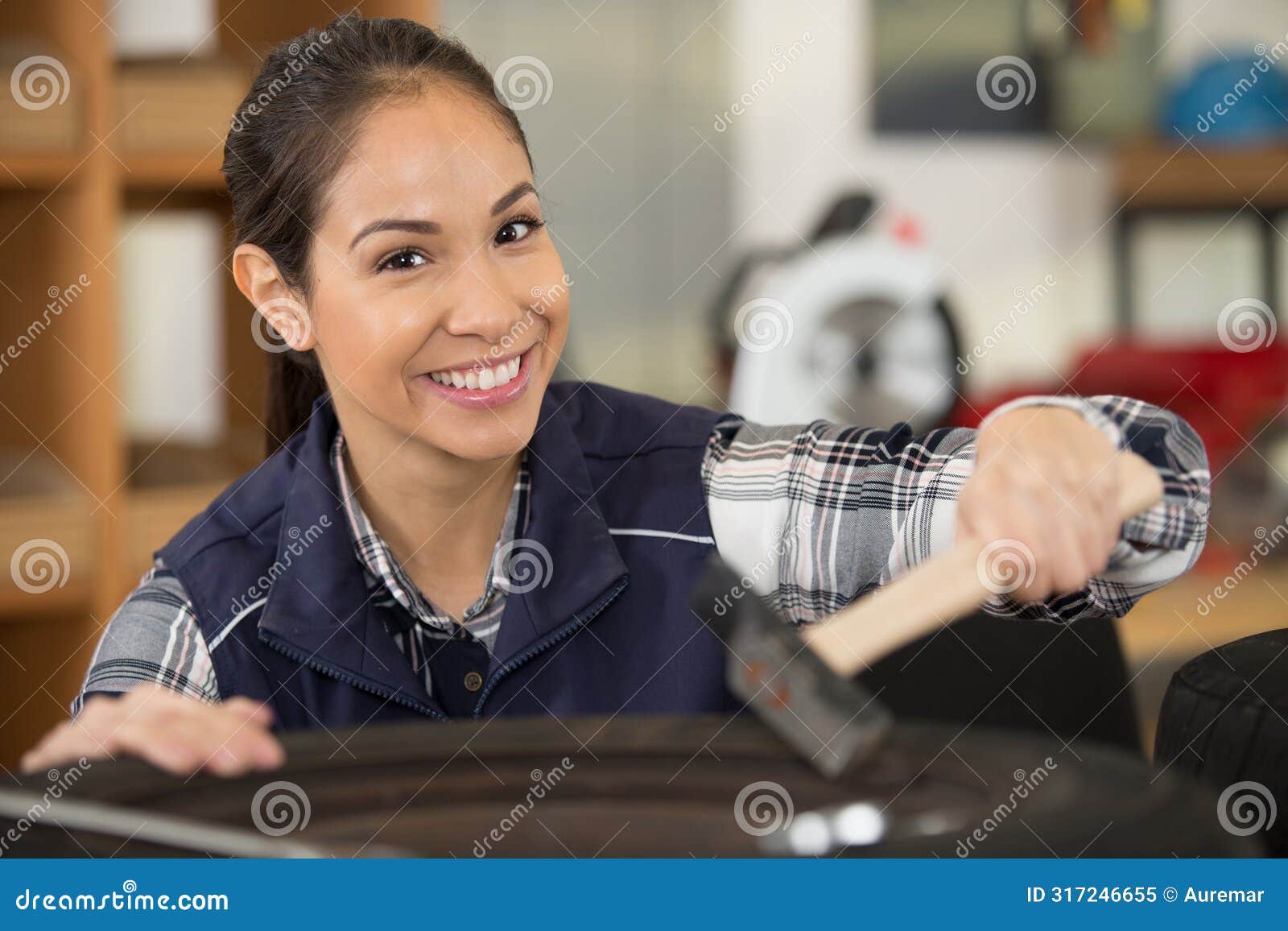 Female Mechanic Using Hammer on Car Wheel Stock Image - Image of sell ...