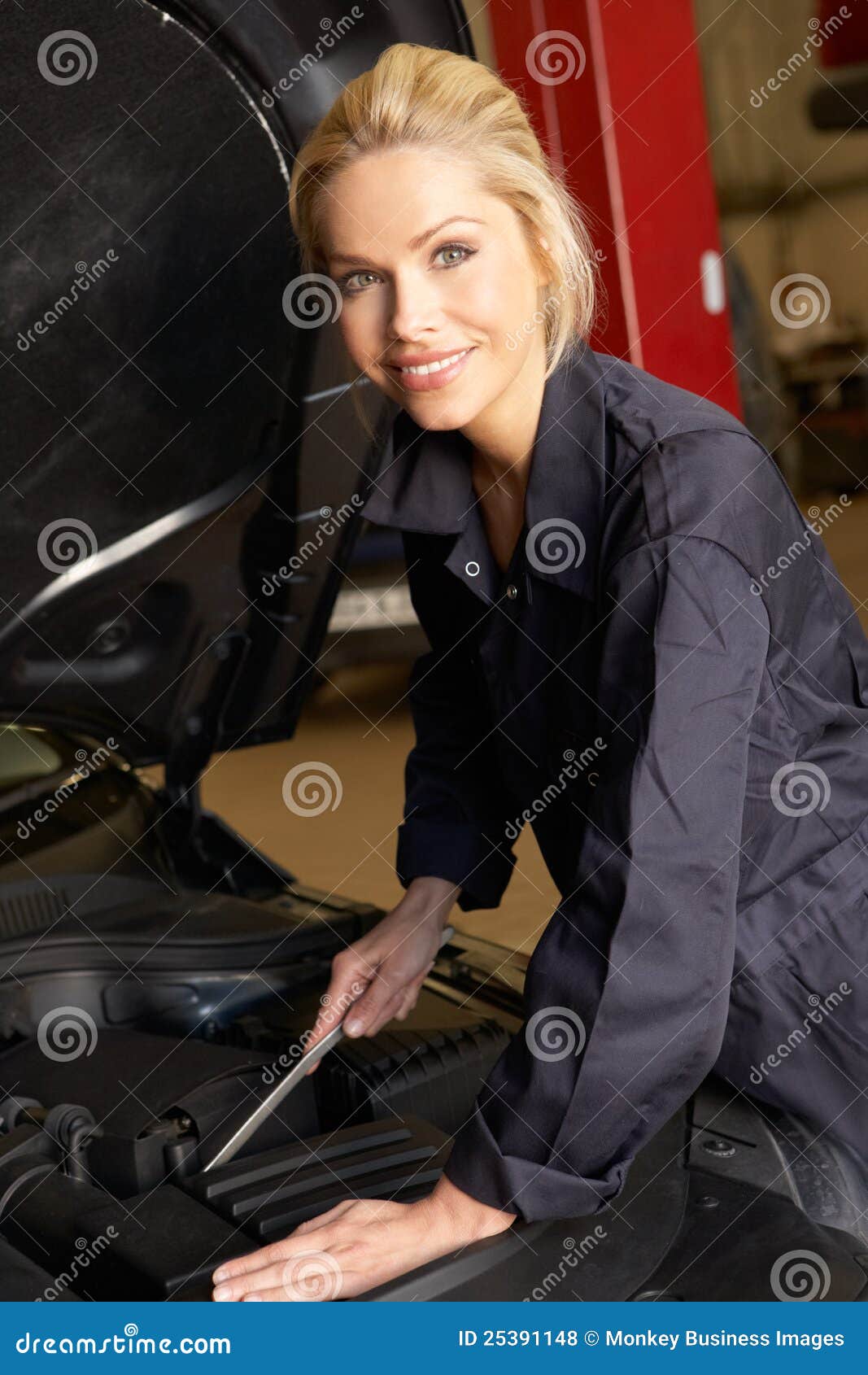Female Mechanic At Work. Auto Service Station. Stock Image ...