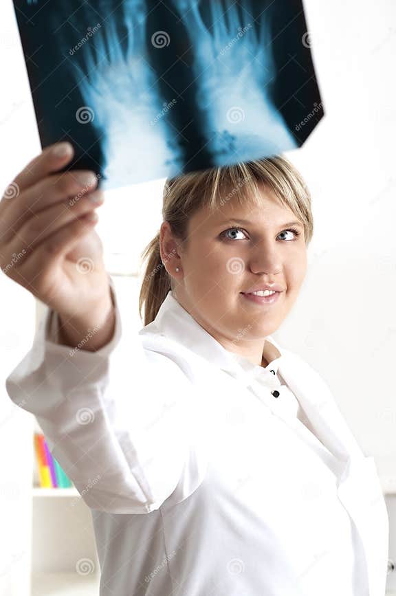 Female Medic Looking at X-rays Stock Image - Image of doctor, hospital ...