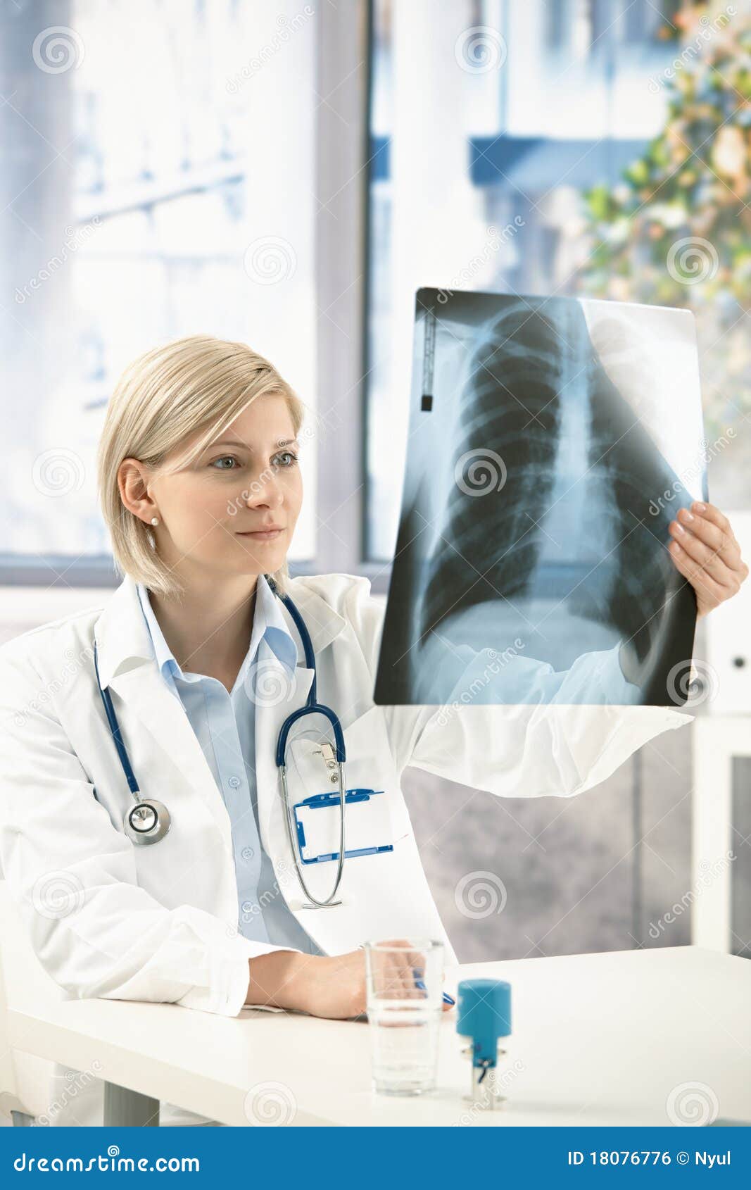 Female Medical Expert Analysing X-ray Image Stock Photo - Image of ...