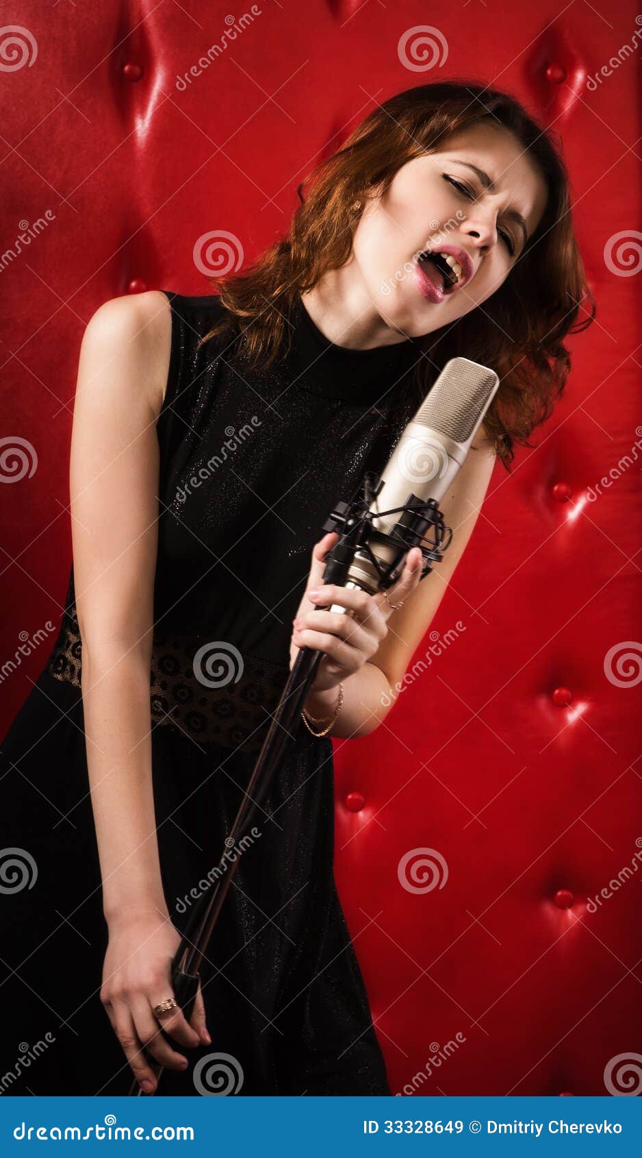 Female with a Microphone on Stage Singing a Song Stock Image - Image of ...