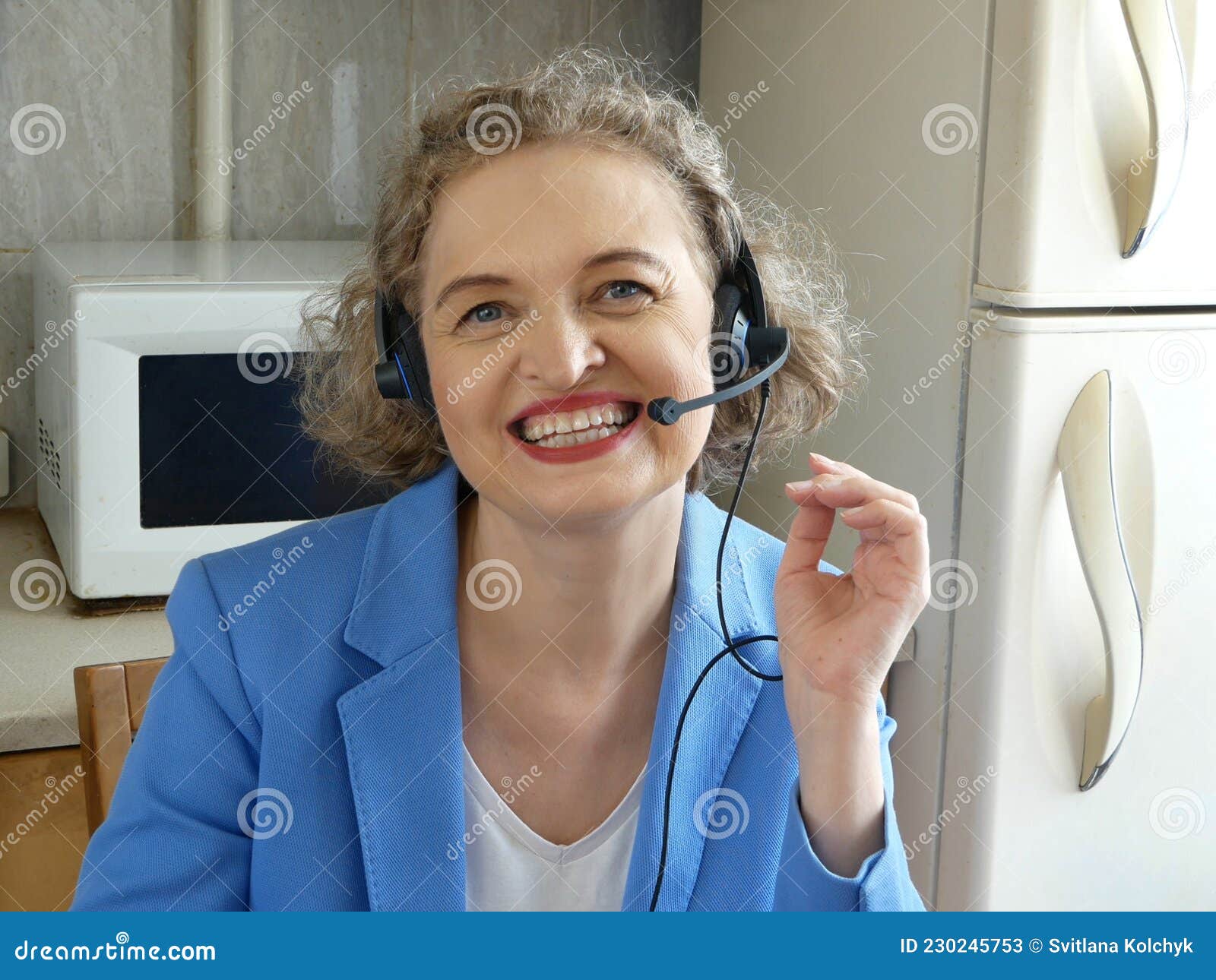 Female Middle Aged Technical Support Agent Working at Home at Kichen ...