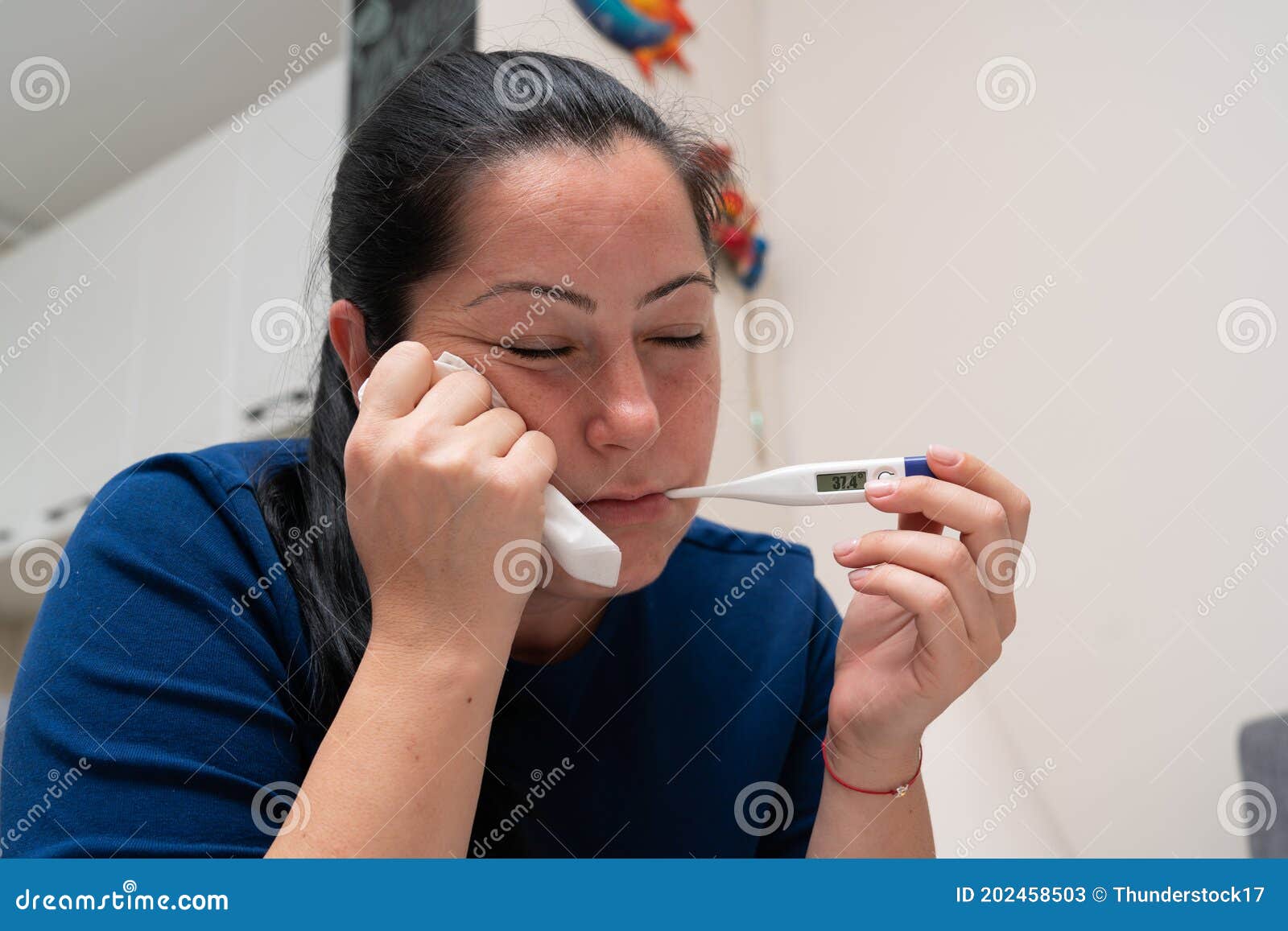 Female Model Checking Body Temperature Using Thermometer Stock Image ...