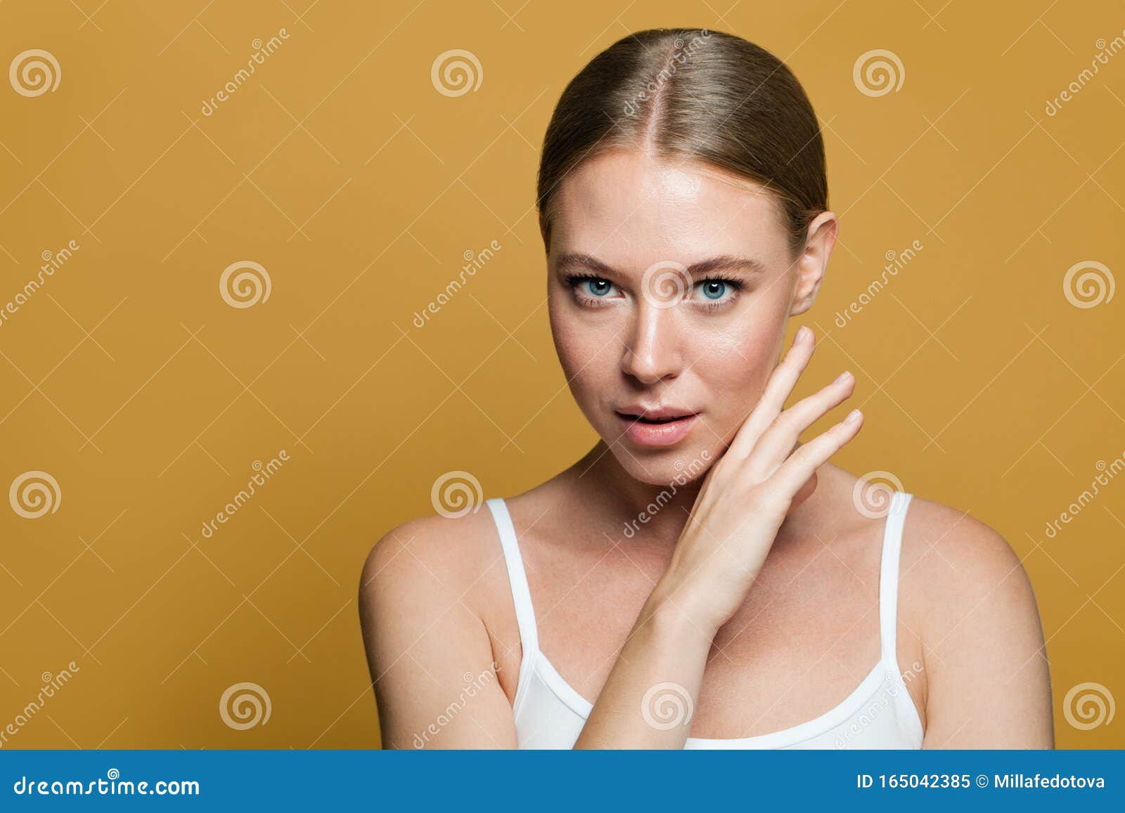 Female Model Looking at Camera on Yellow Background Stock Image - Image ...
