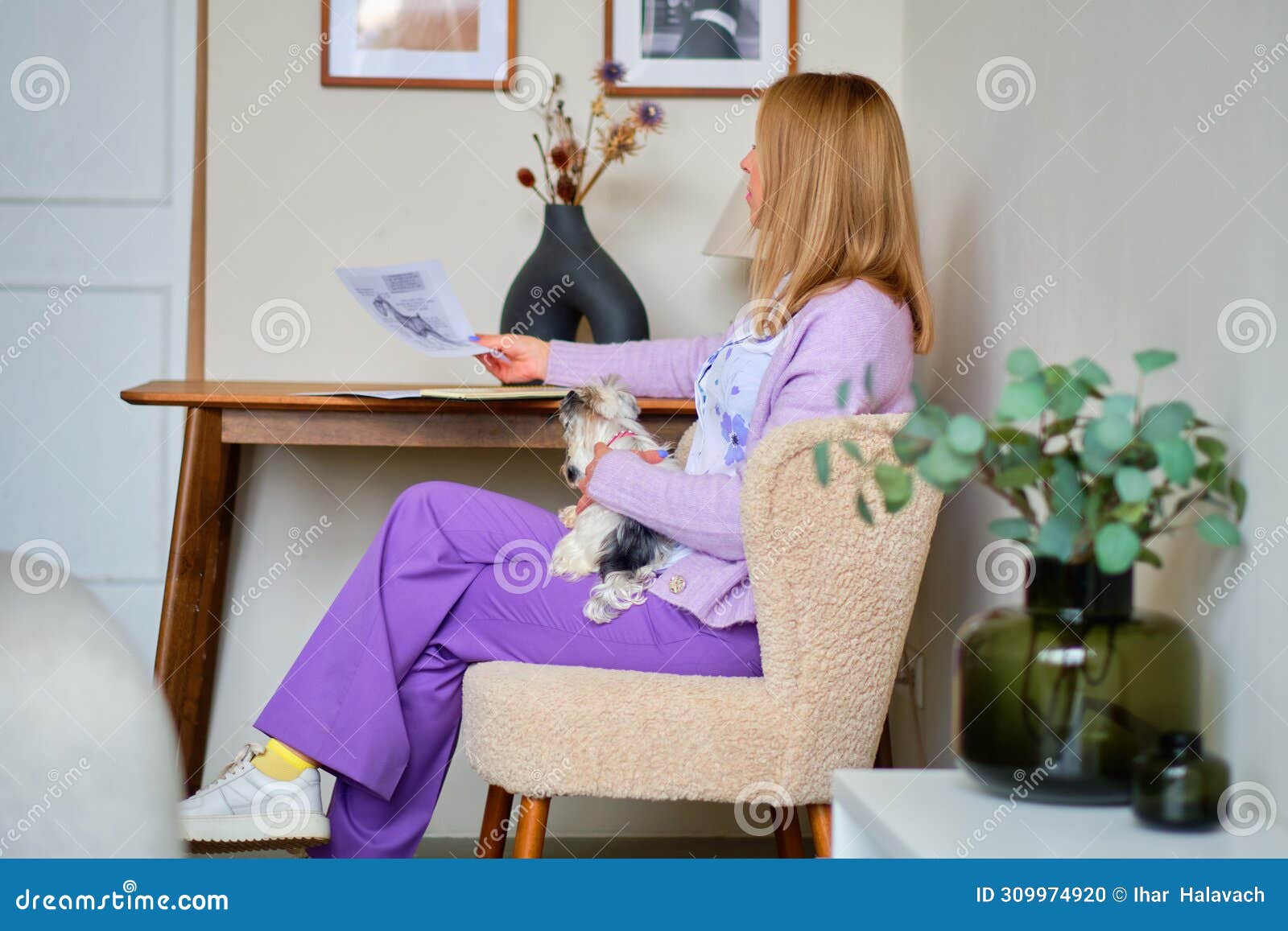 A Female Model is Sitting at a Table Studying the Material Stock Photo ...